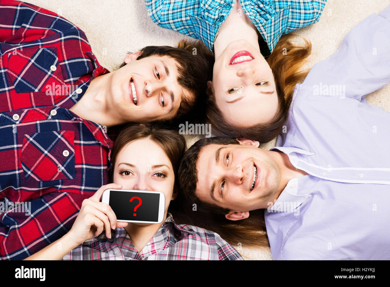 four young men lie together Stock Photo - Alamy