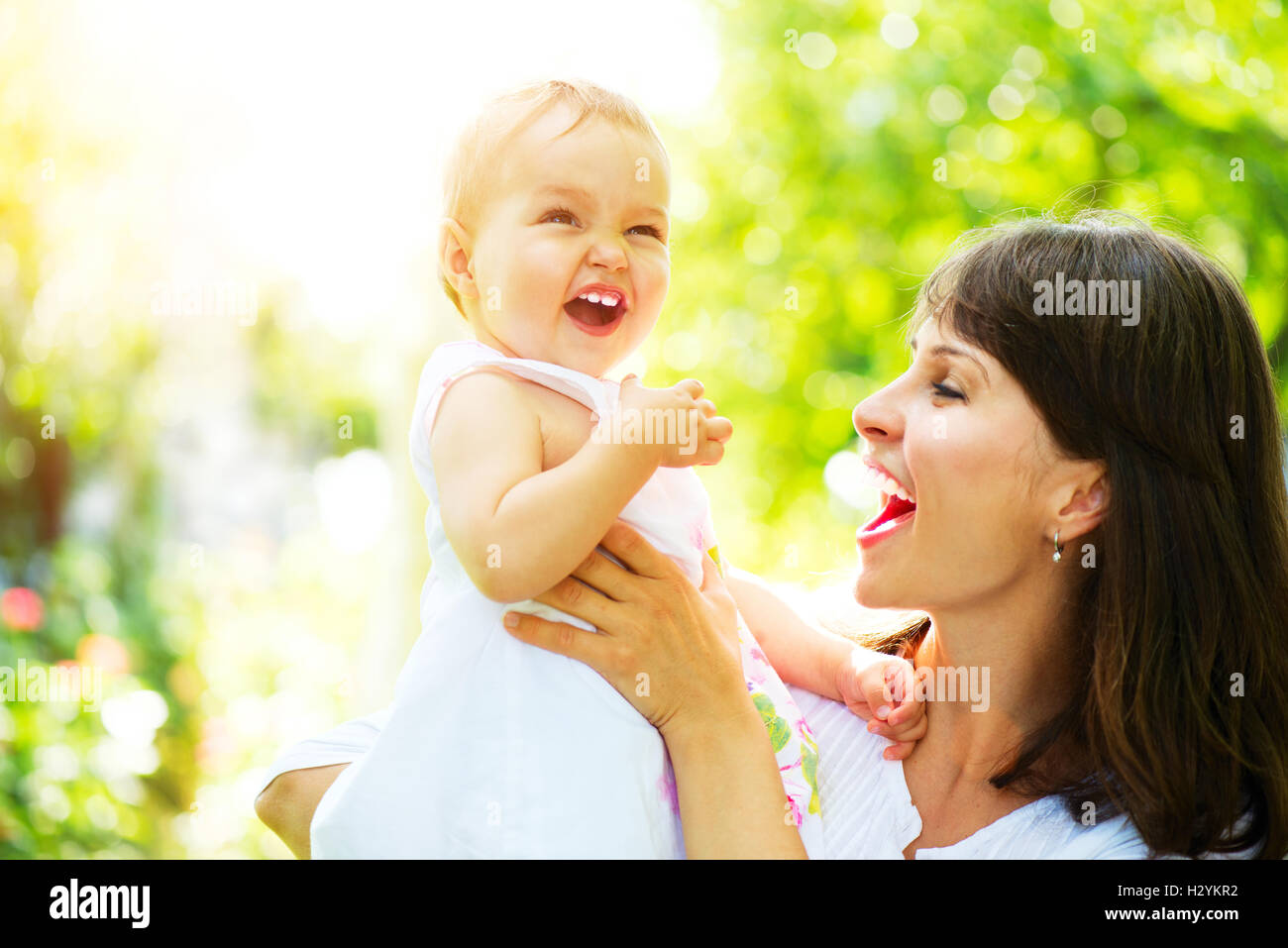 Beautiful Mother And Baby Outdoors. Nature Stock Photo - Alamy