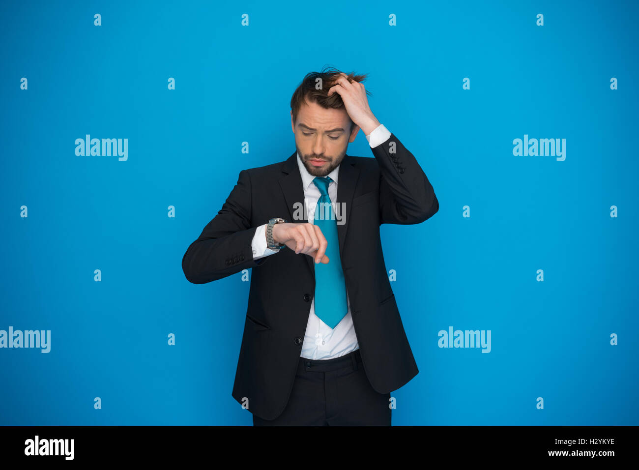 businessman in rush looking at his watch , running late Stock Photo - Alamy
