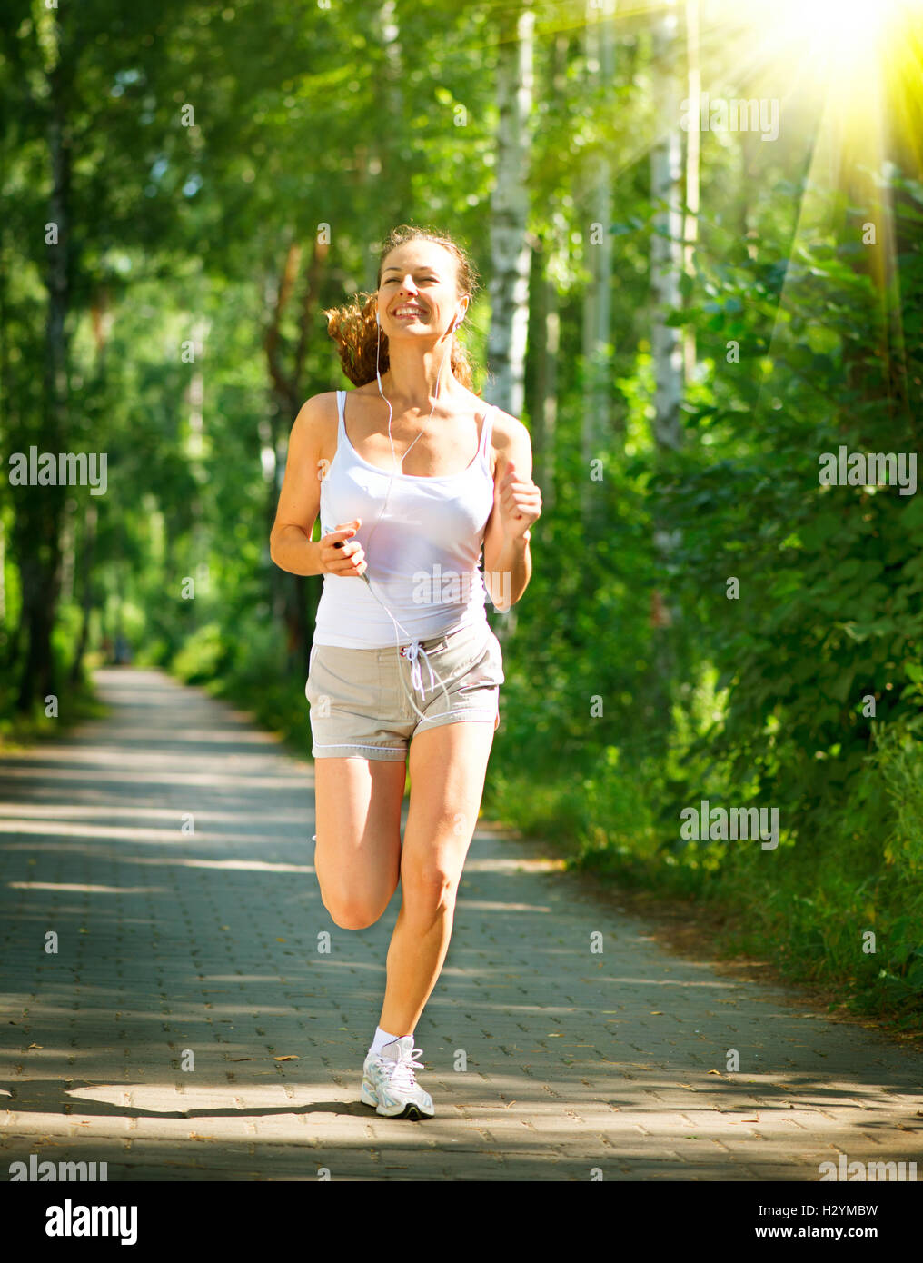Running Woman. Outdoor Workout in a Park. Full Length Portrait Stock ...