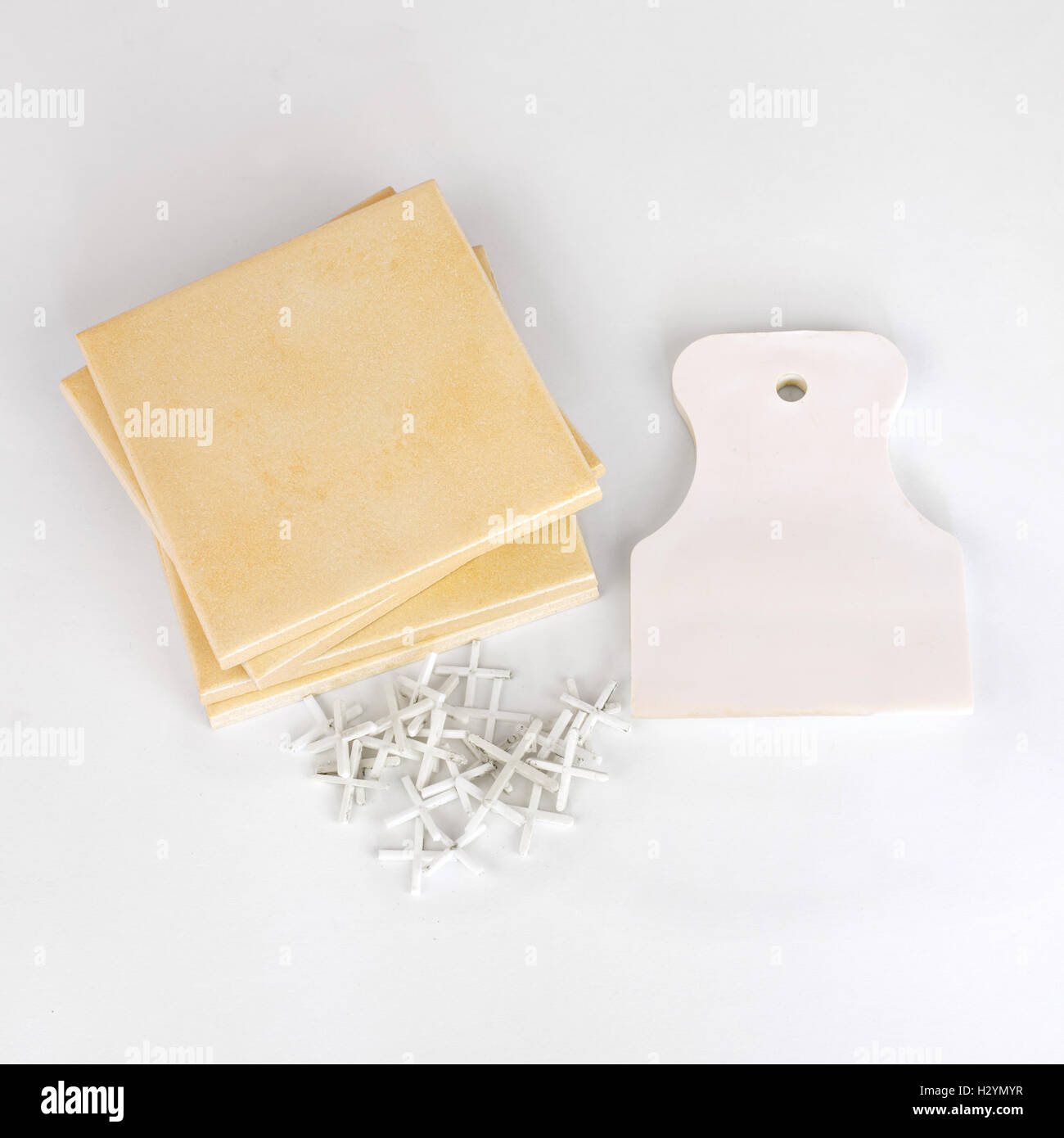 Stack of ceramic tiles and tools Stock Photo - Alamy