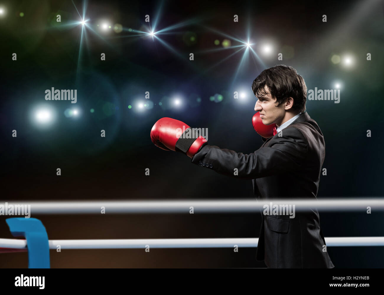 businessman with boxing gloves in the ring Stock Photo - Alamy