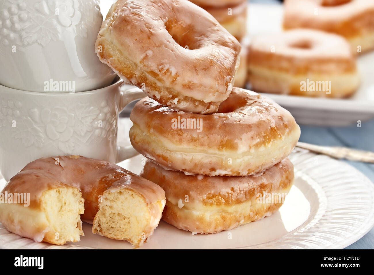 Stack of Donuts and Cups Stock Photo - Alamy