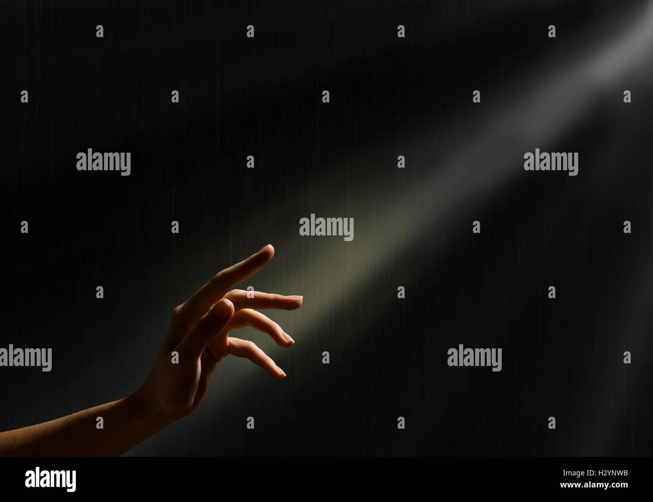 woman's hand reaches for the light rays Stock Photo - Alamy