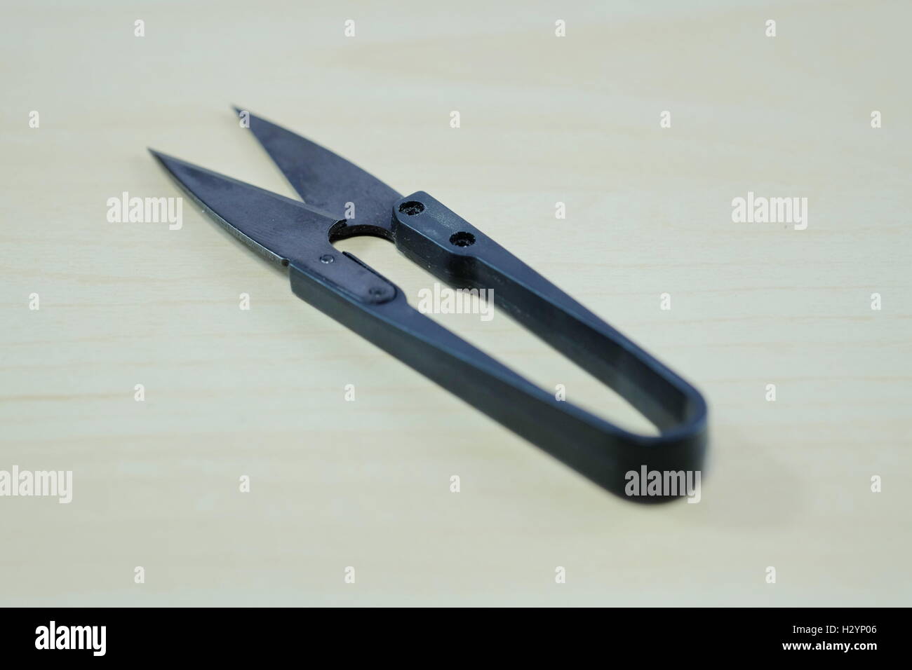 scissors on wood background Stock Photo - Alamy