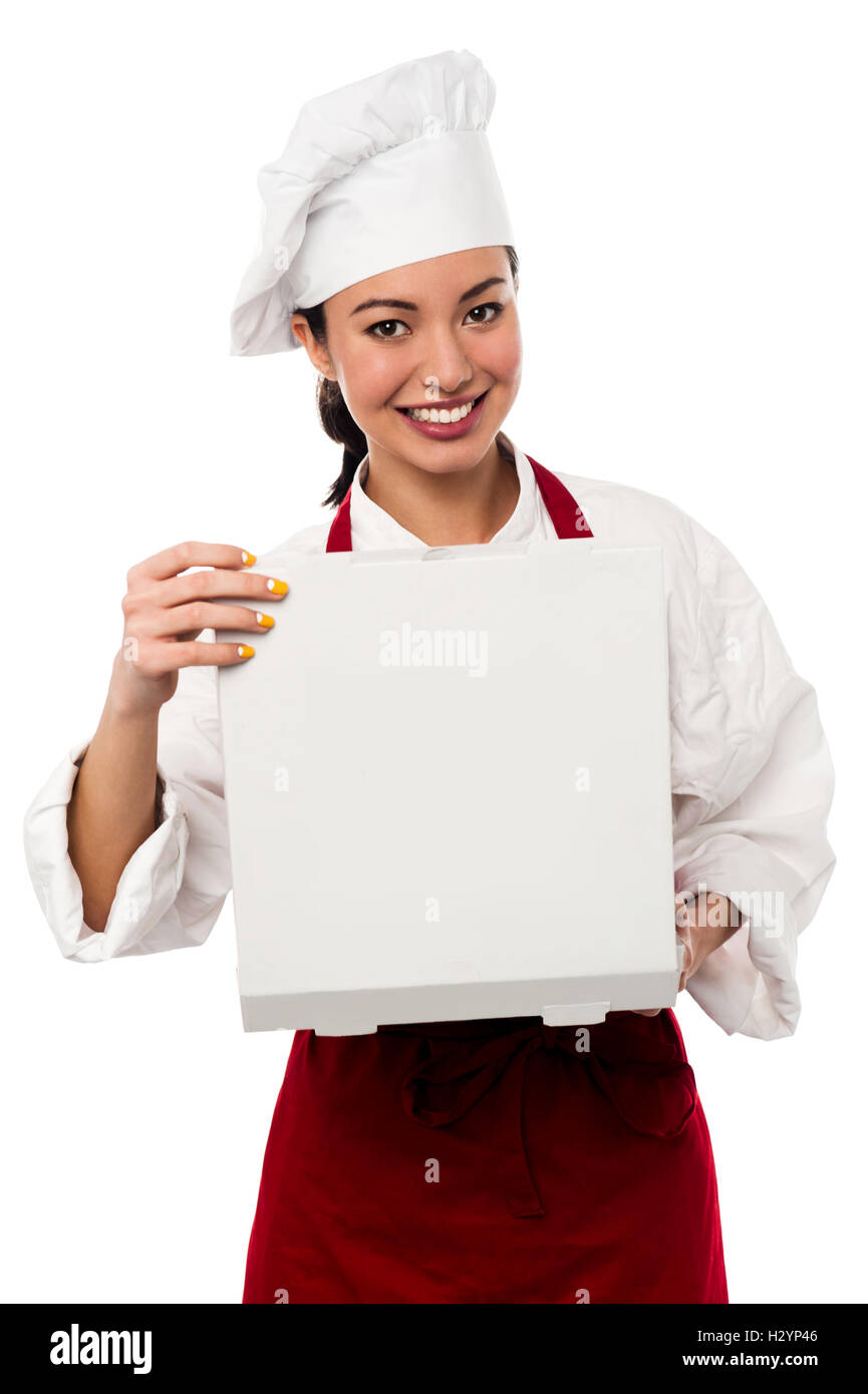 Smiling female chef opening pizza box Stock Photo - Alamy