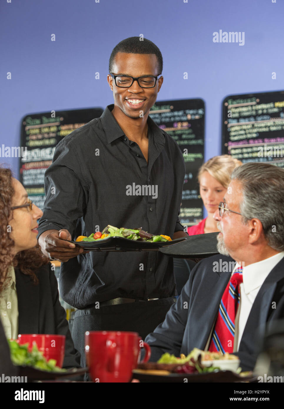 Barista Bringing Food Stock Photo - Alamy