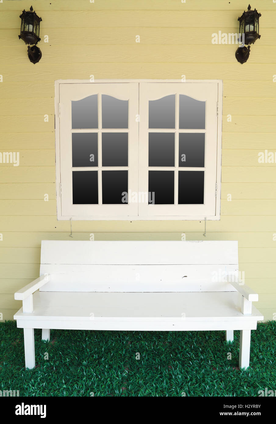 wooden bench for rest under the window Stock Photo - Alamy