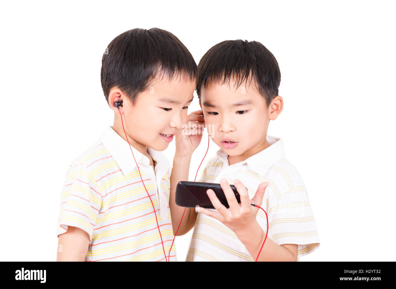 Cute children listen to music Stock Photo - Alamy