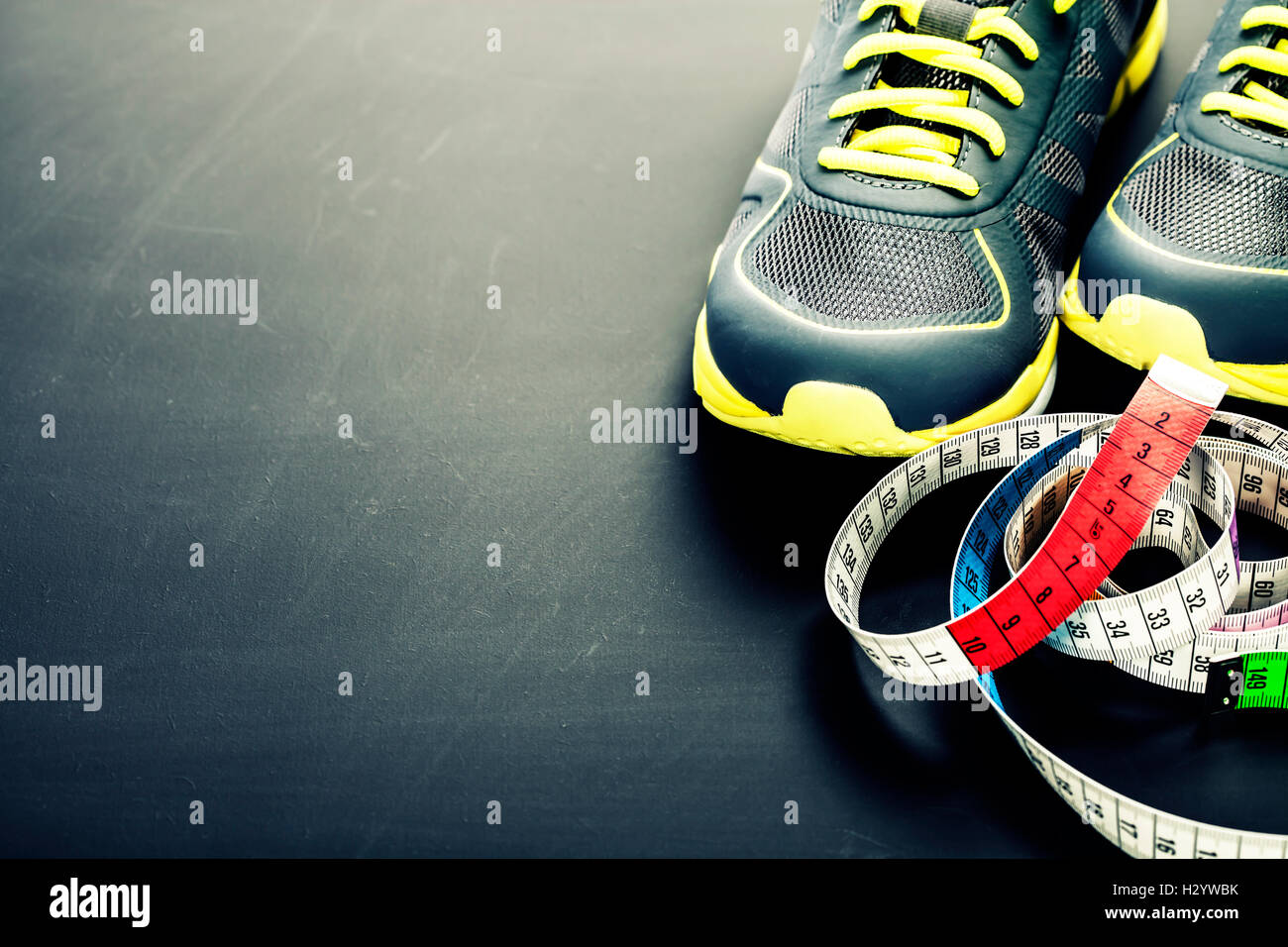 Sport shoes and measuring type Stock Photo - Alamy