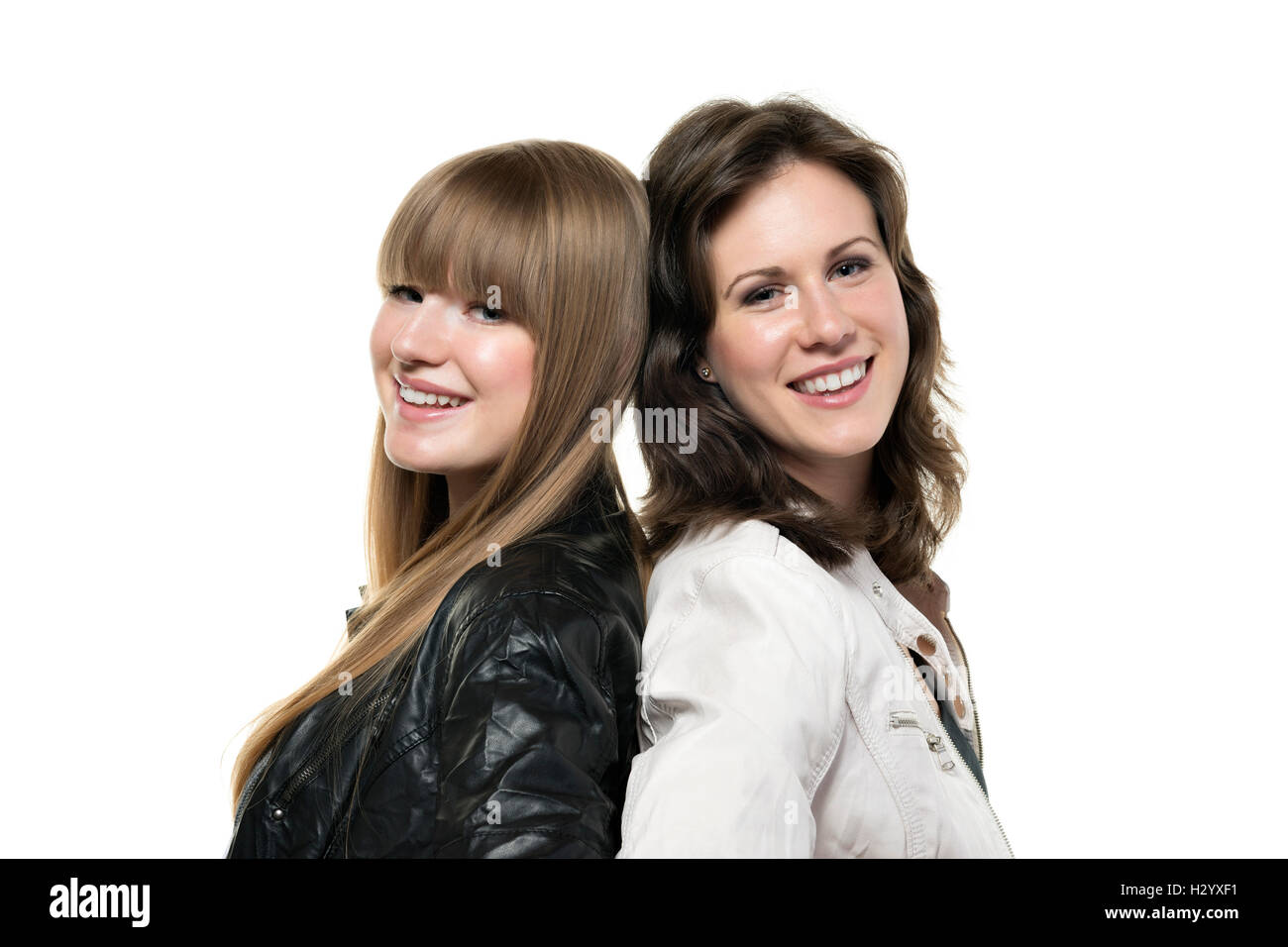Two women back to back Stock Photo - Alamy