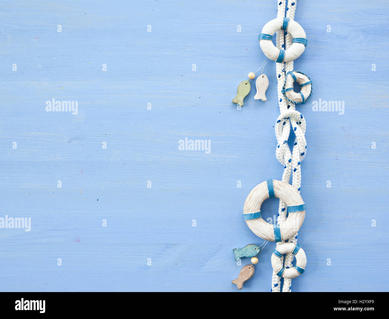 Blue background with a reef knot Stock Photo - Alamy