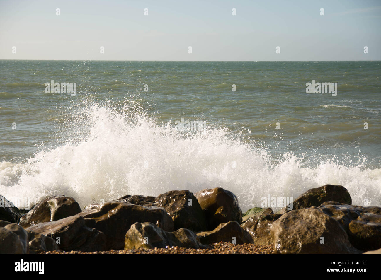 ocean waves crushing on rocks Stock Photo - Alamy