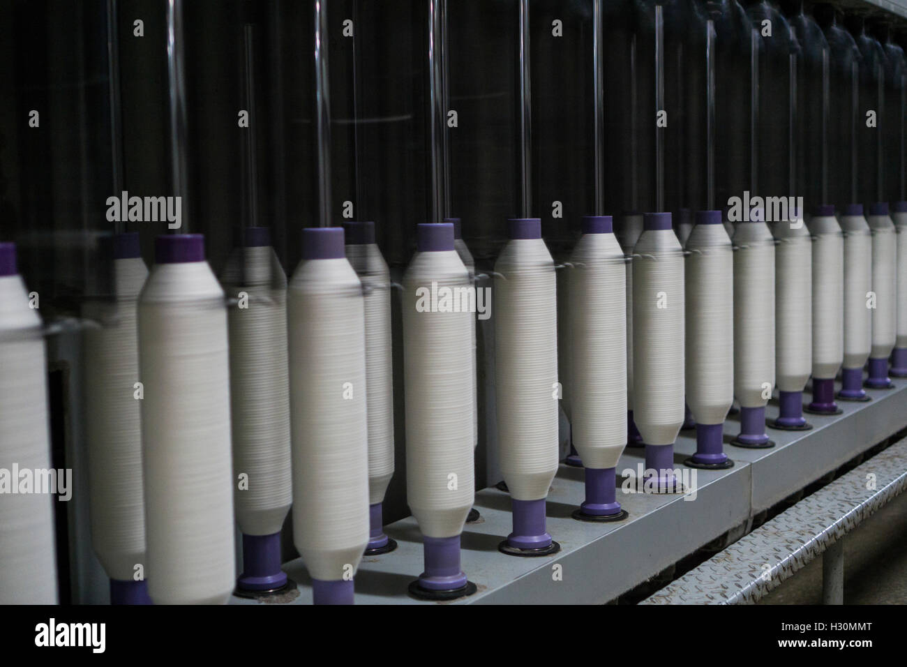 Cotton spools inside cotton mill Multan Pakistan Stock Photo - Alamy