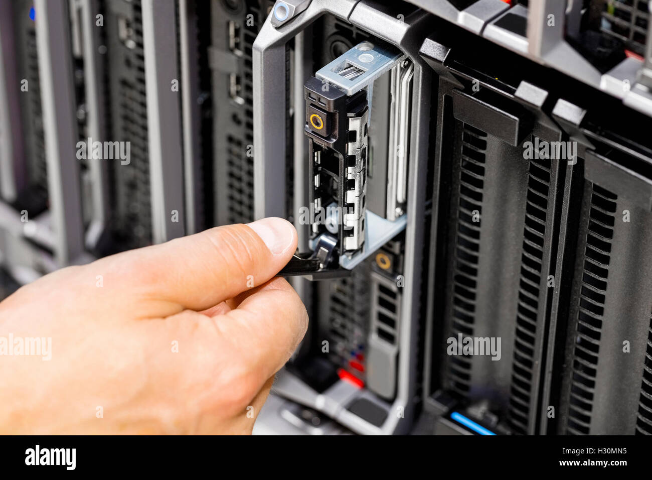 Engineer's Hand Working On Server At Data Center Stock Photo - Alamy