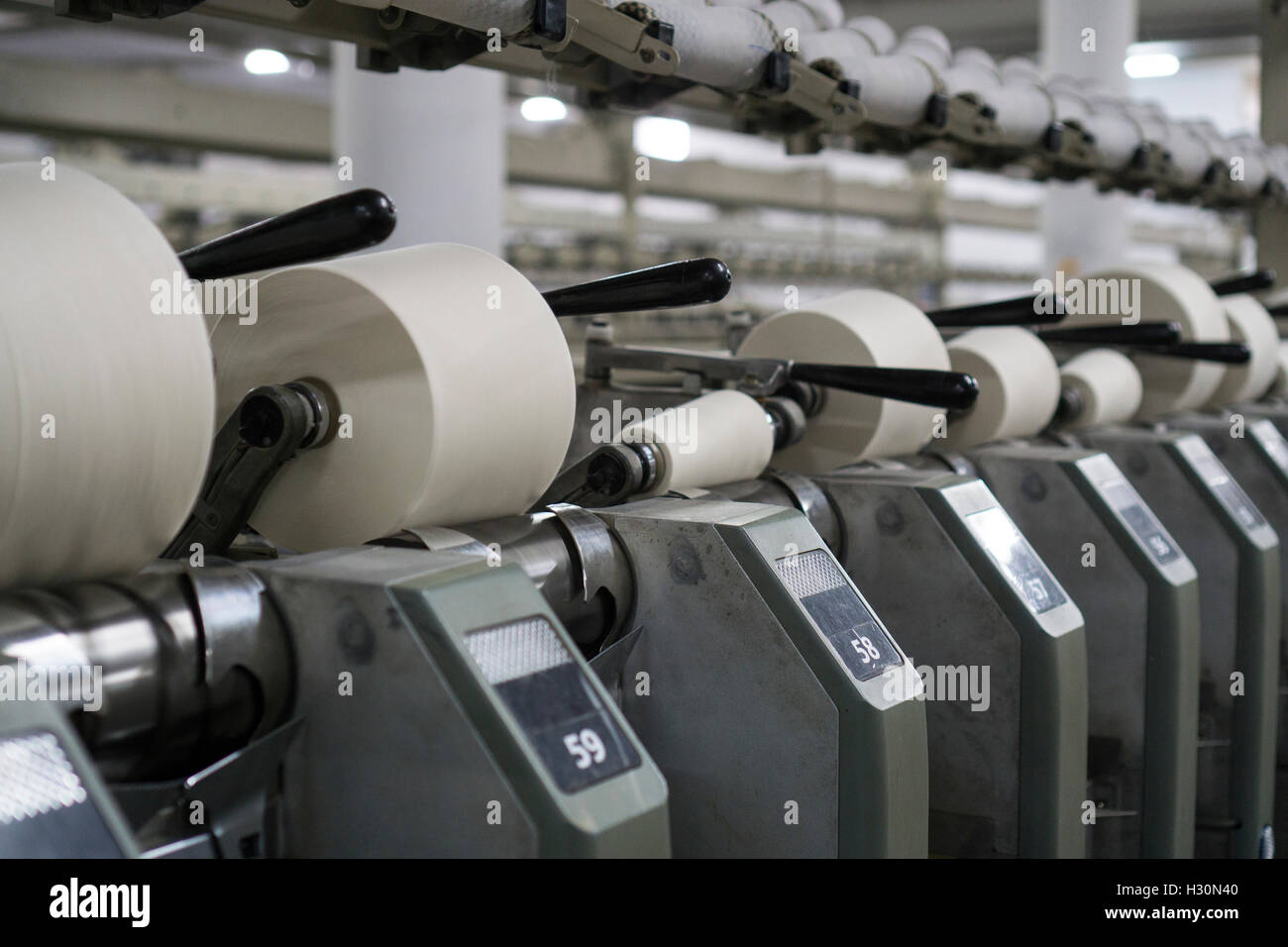 Cotton spools inside cotton mill Multan Pakistan Stock Photo - Alamy