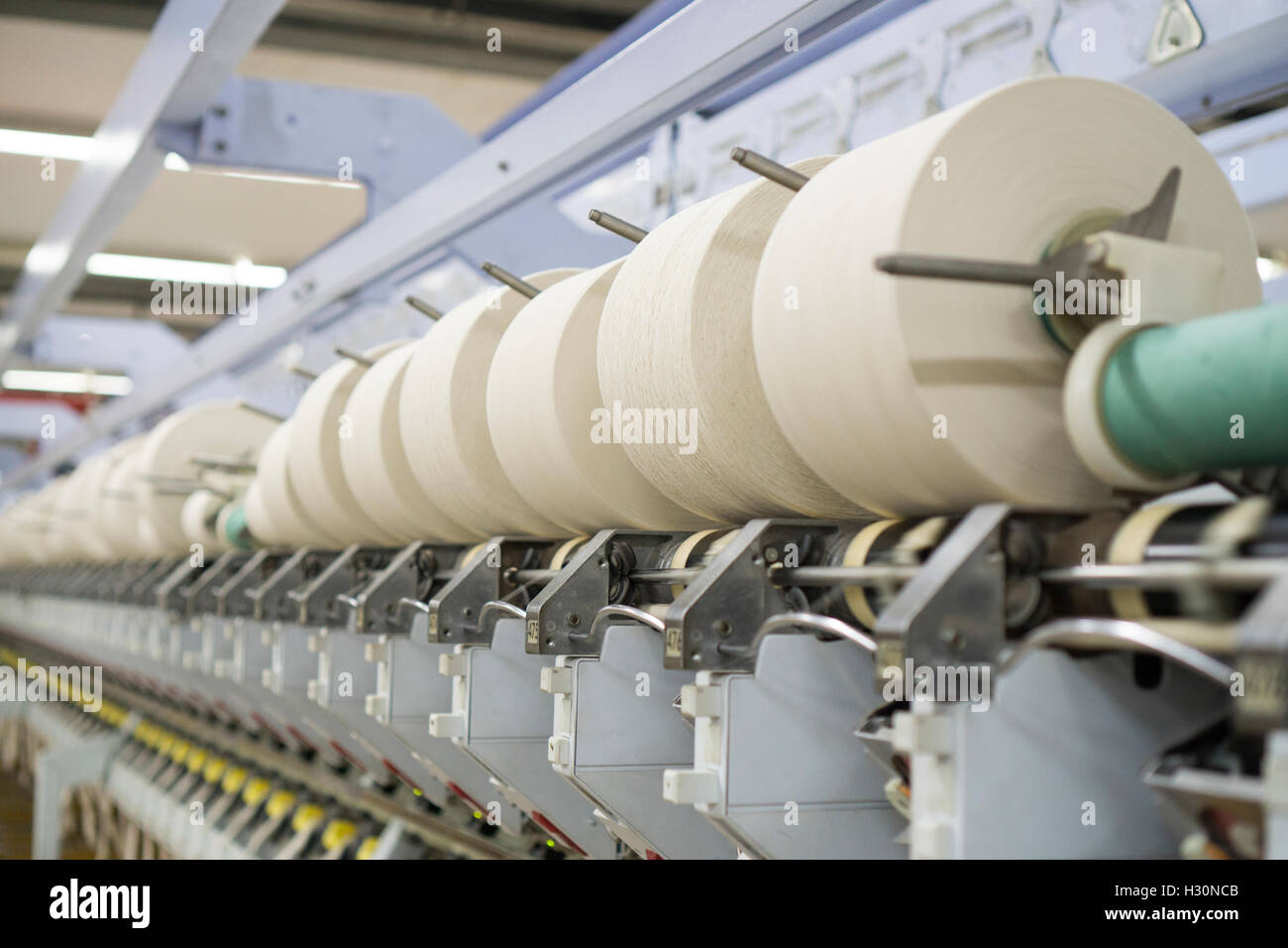 Cotton spools inside cotton mill Multan Pakistan Stock Photo - Alamy