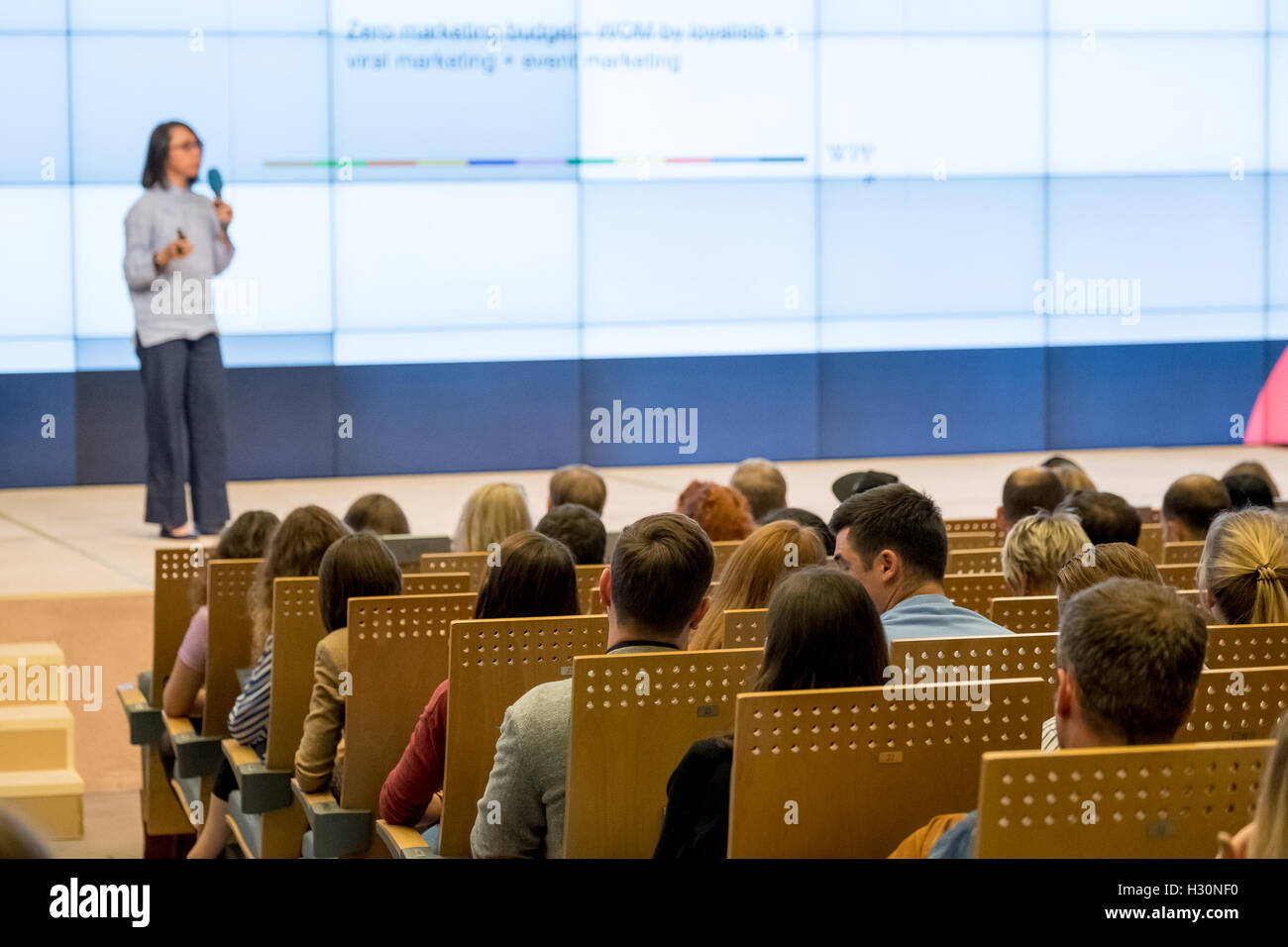 Audience listening a lecture Stock Photo - Alamy