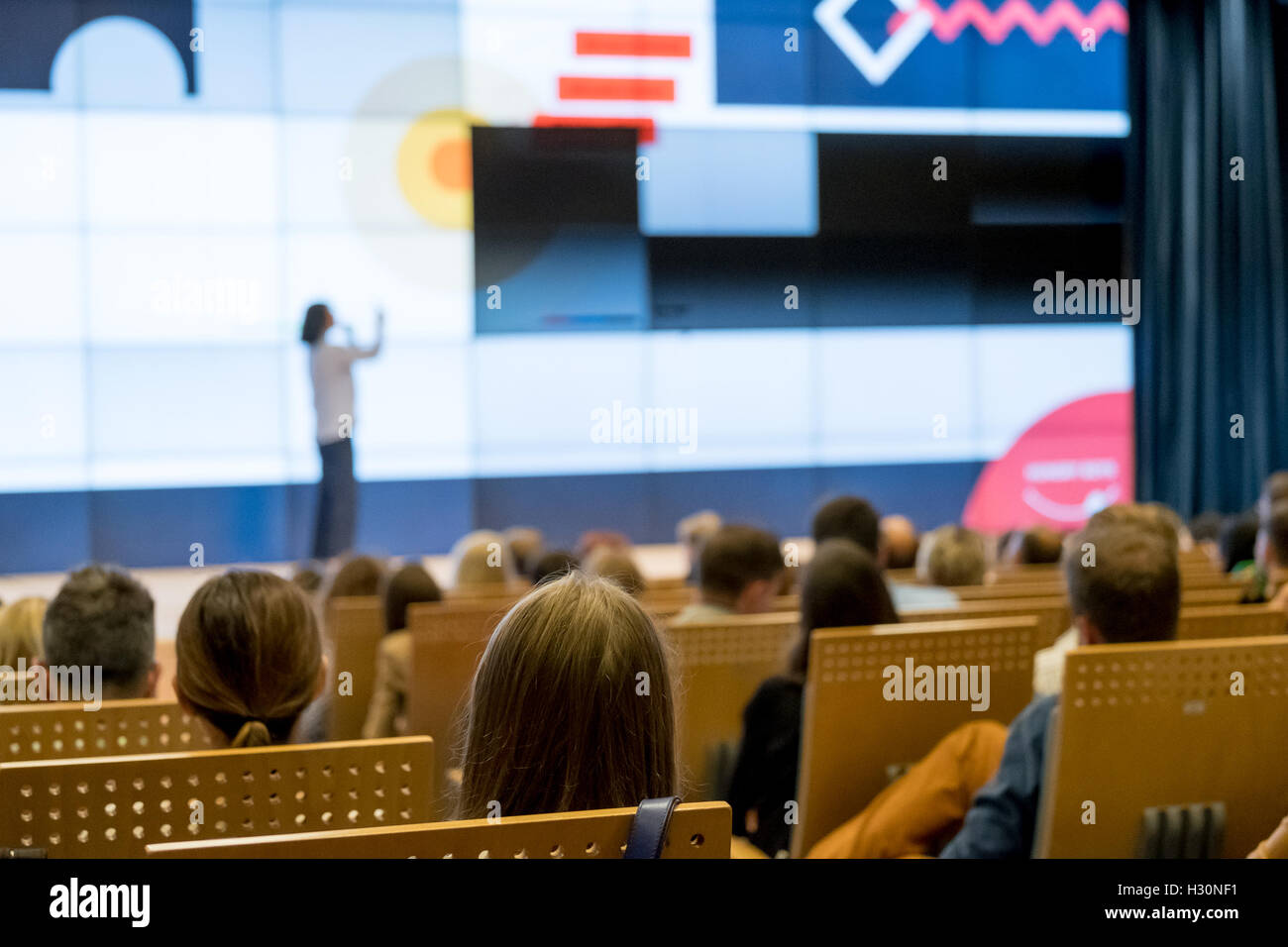 Audience listening a lecture Stock Photo - Alamy