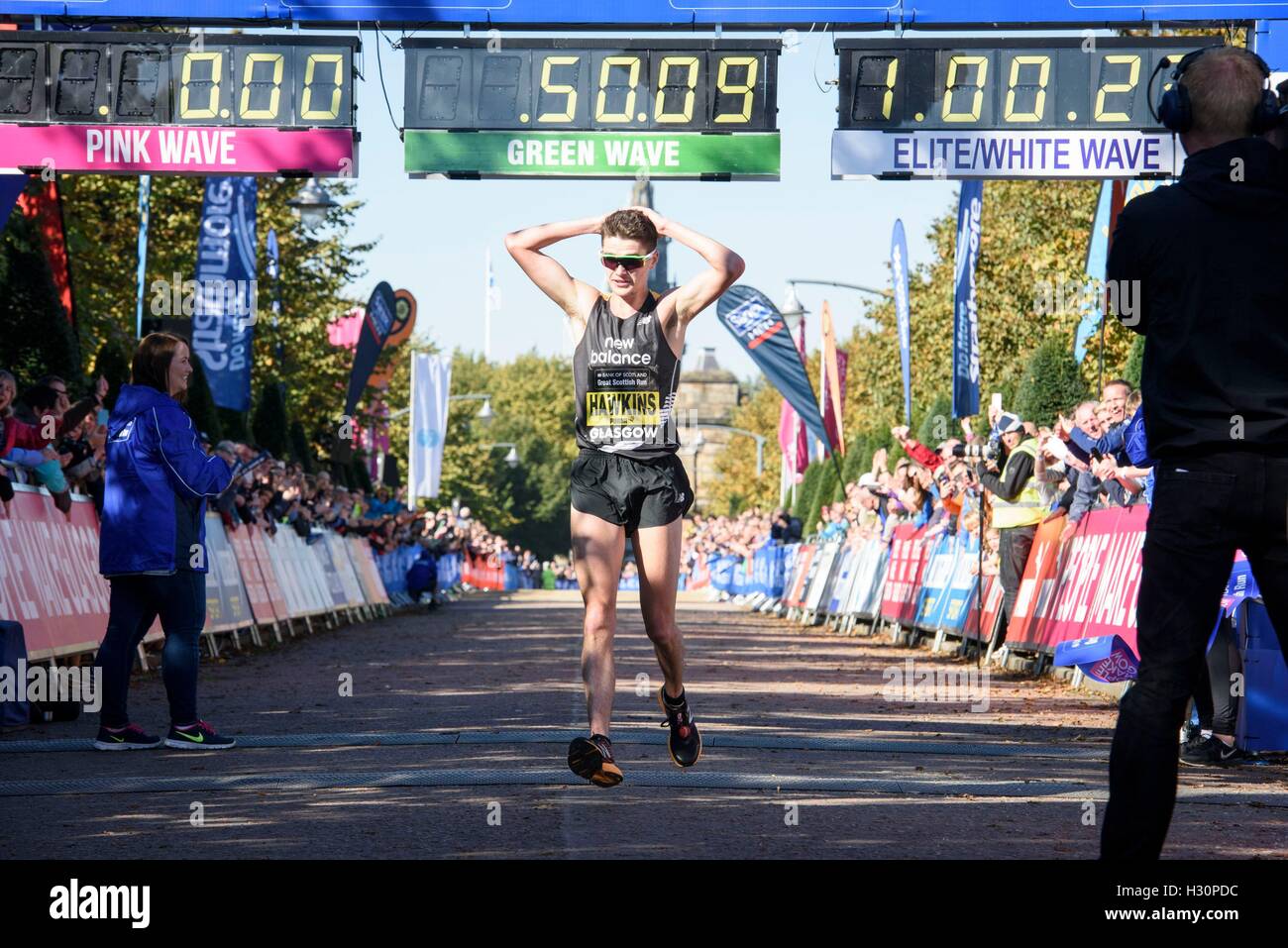 Scottish runner Callum Hawkins crosses the finishing line to win the ...