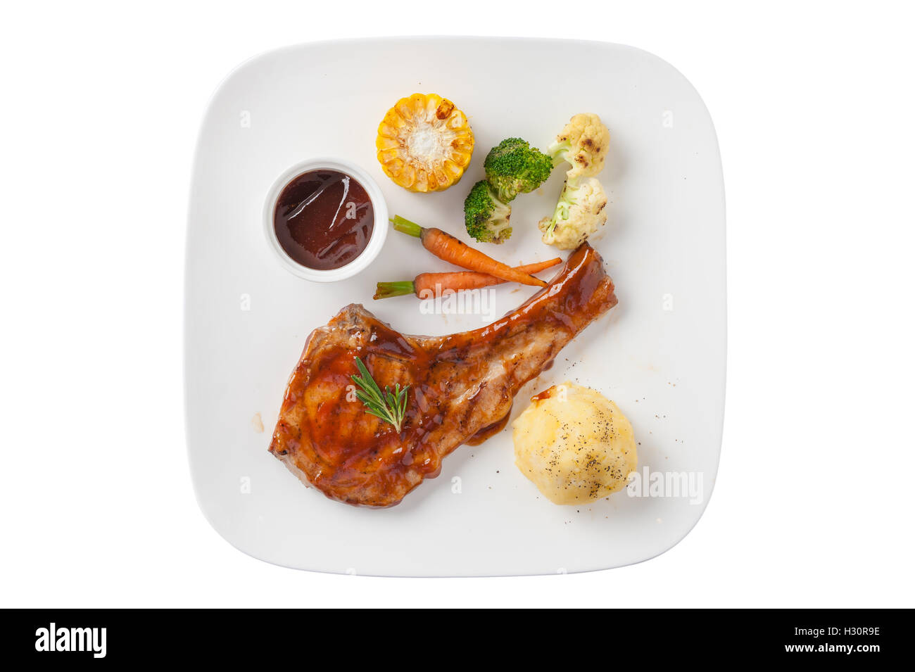 Top view of modern style pork chop with barbecue sauce, mashed potatoes ...