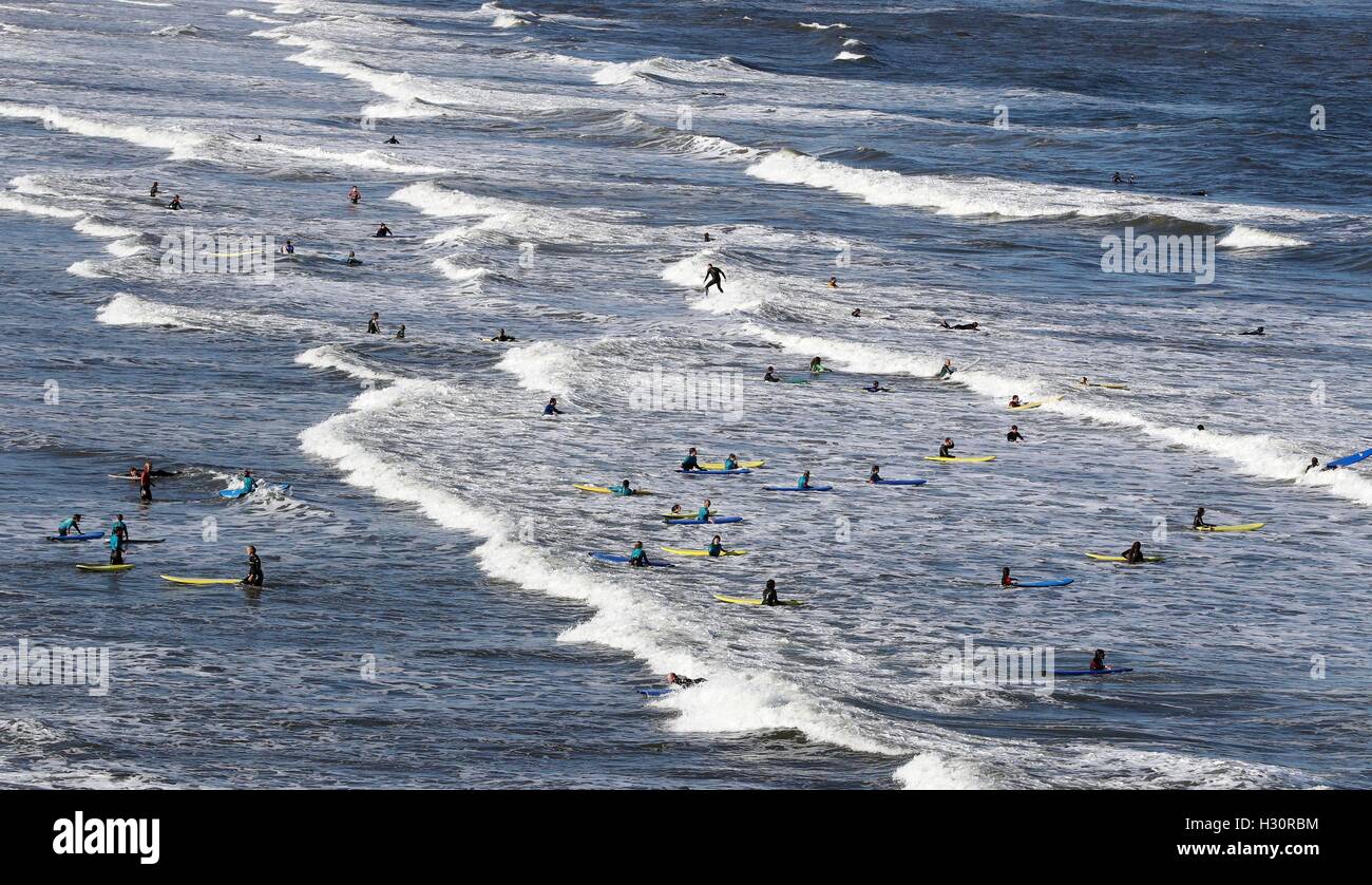 Dozens of surfers enjoy the autumn sunshine at Tynemouth beach in Tyne ...
