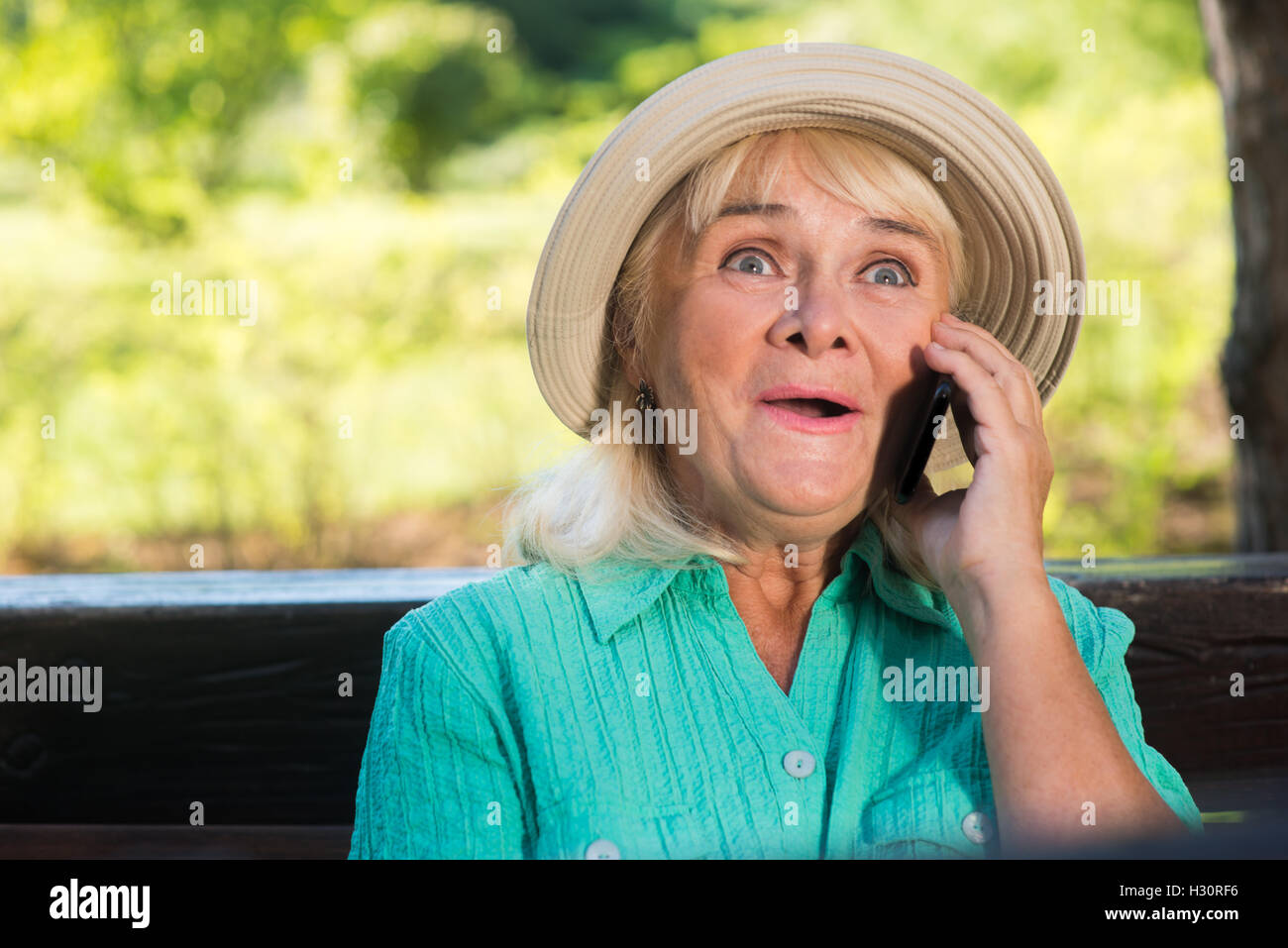 Surprised lady with a phone Stock Photo - Alamy
