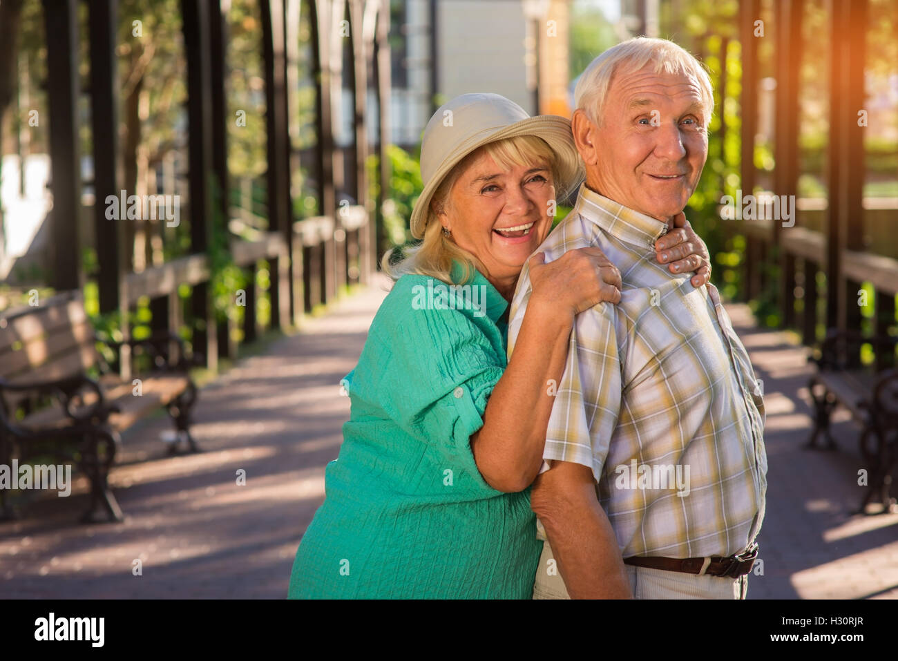 Senior woman is hugging man Stock Photo - Alamy