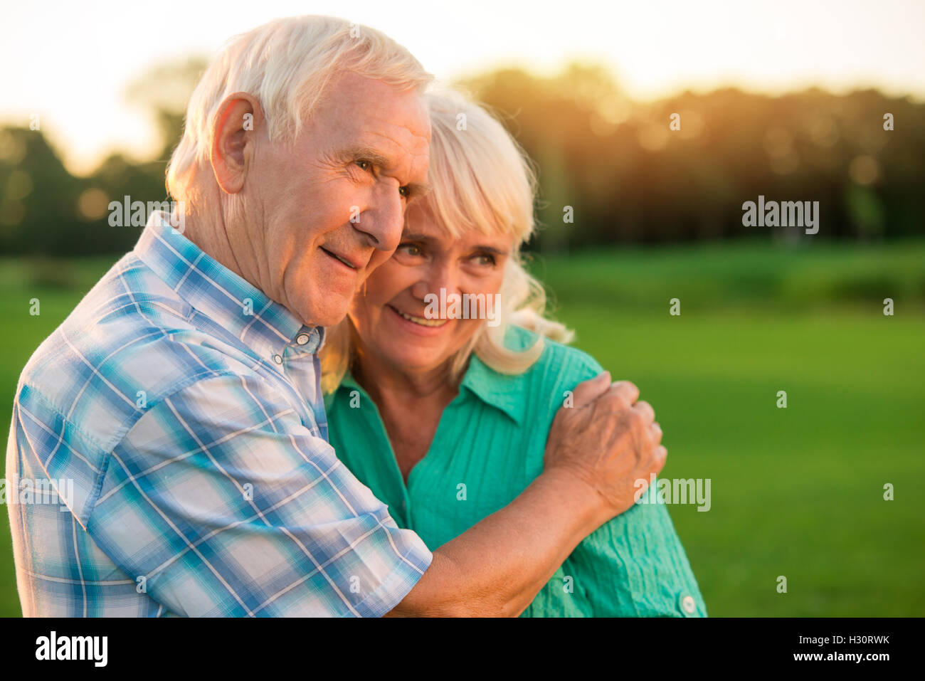 Senior man hugging woman Stock Photo - Alamy