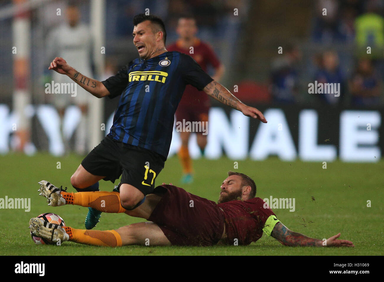 Stadium Olimpico, Rome, Italy. 02nd Oct, 2016. Medel is slide tackled ...