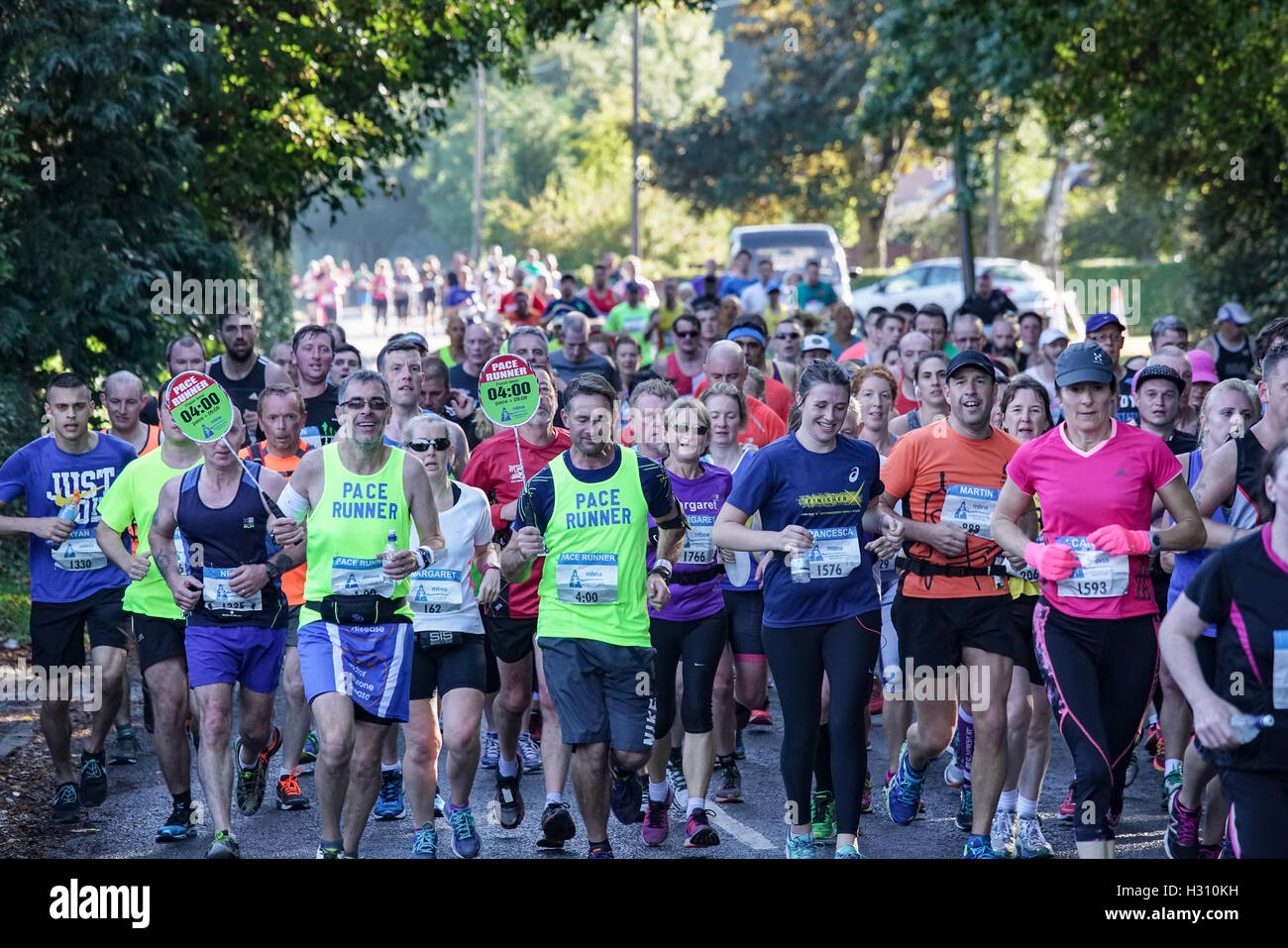 Runners in the Chester Marathon bunch up behind the 4 hour pace runner ...