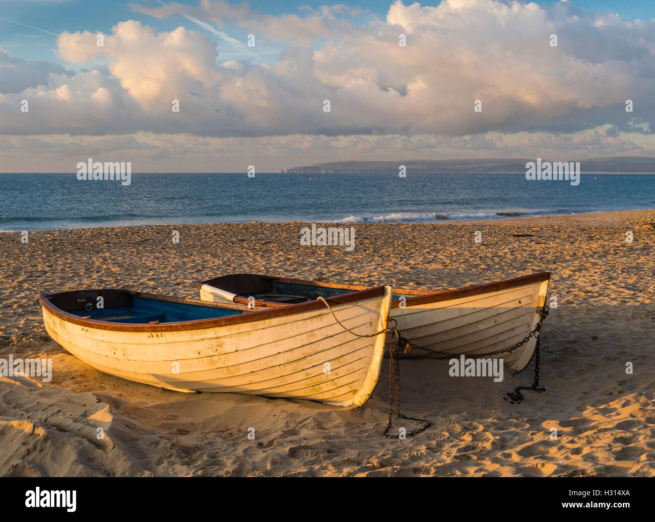 Two Fishing Boats on Bournemouth West Beach in early morning low light ...