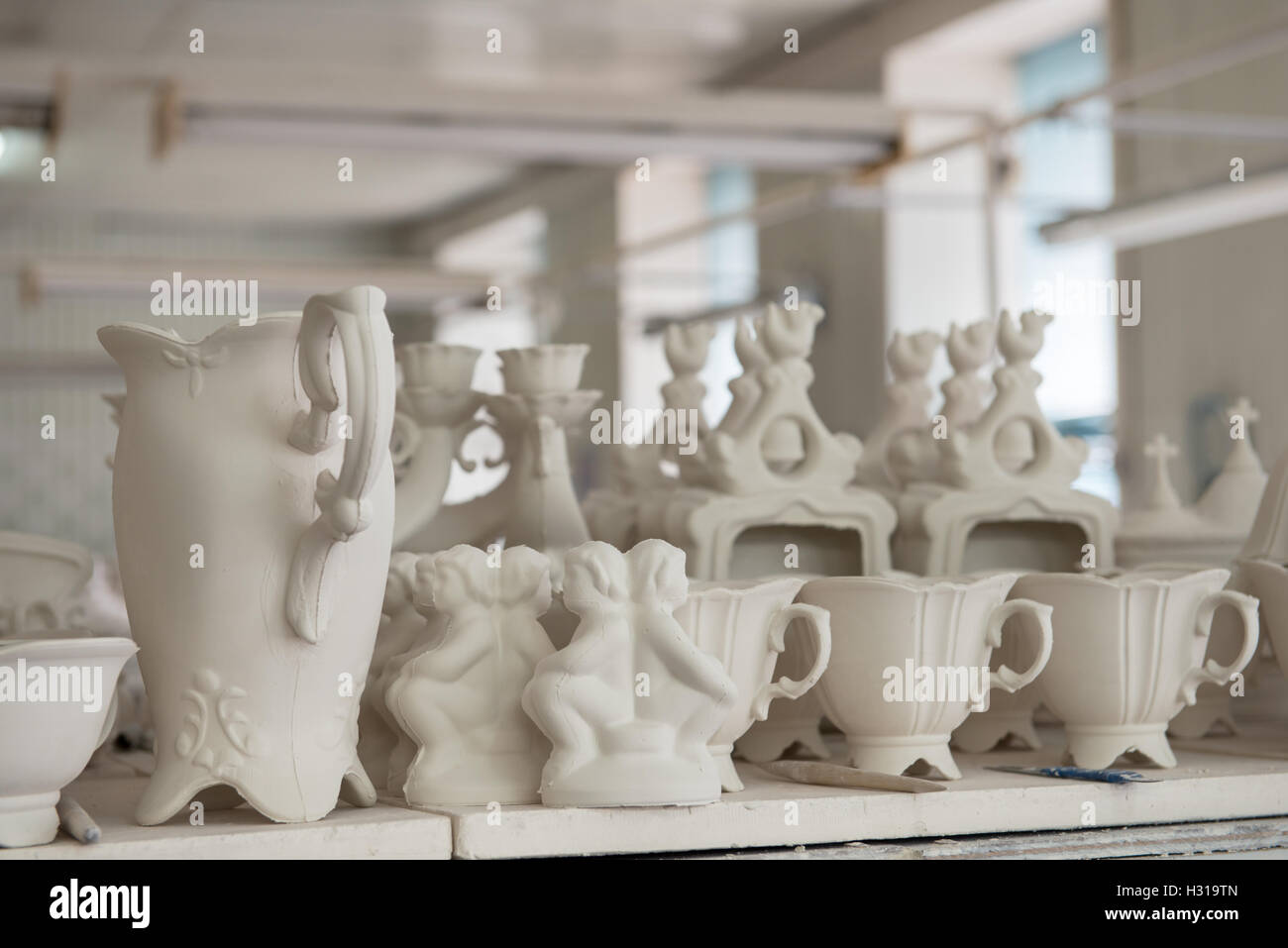 Formed clay ware under production in potter's workshop Stock Photo - Alamy
