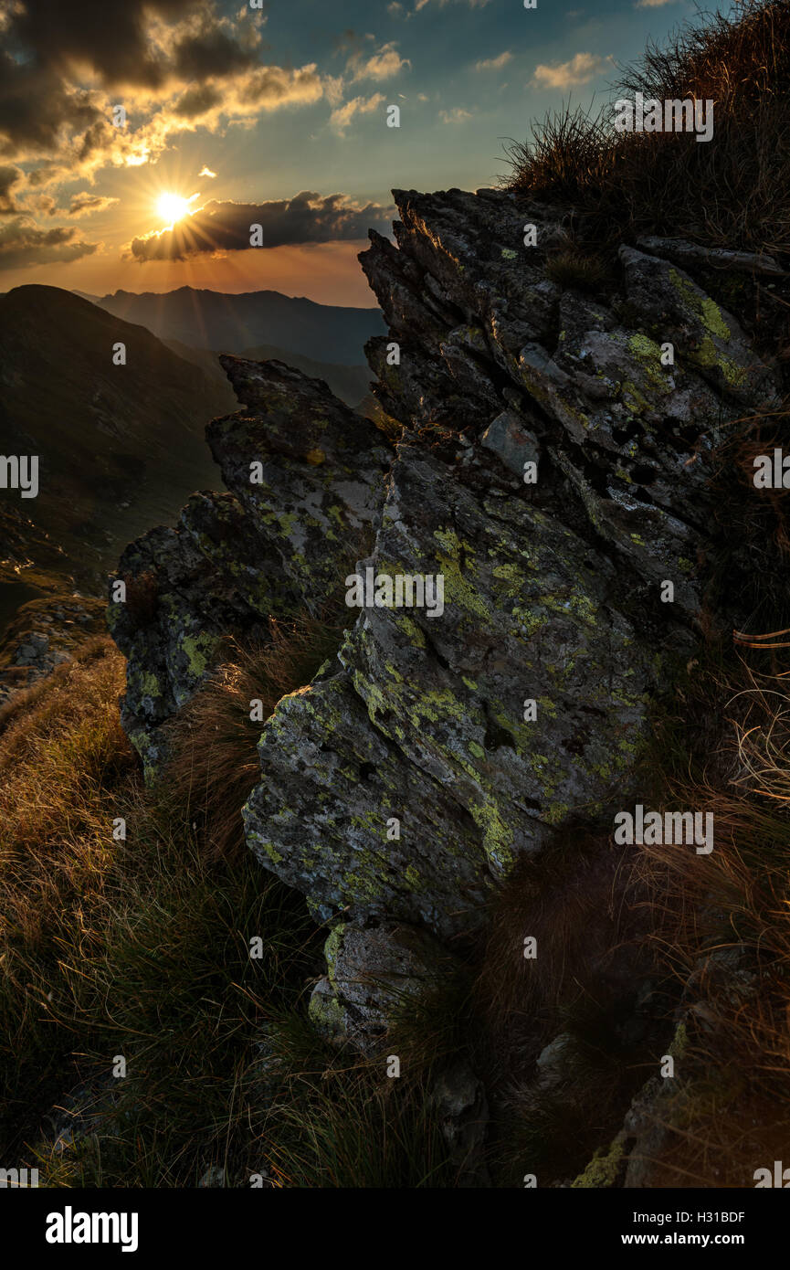 Landscape with mountain peaks at sunset in the golden hour Stock Photo ...