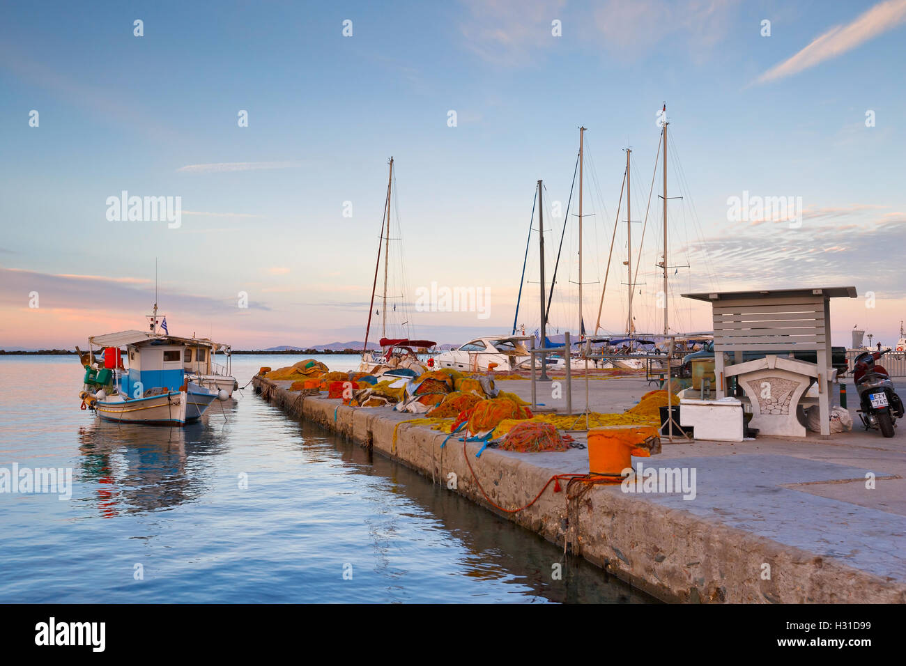 Fishing boats and sail boats in the port of Tinos Stock Photo - Alamy