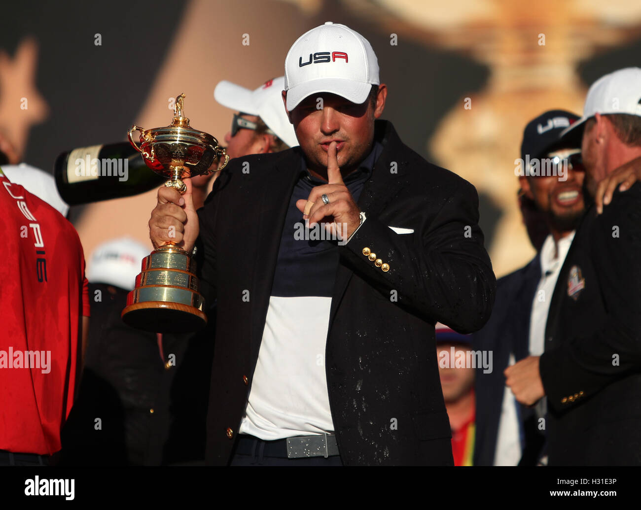 USA's Patrick Reed celebrates with the trophy after the USA won the ...
