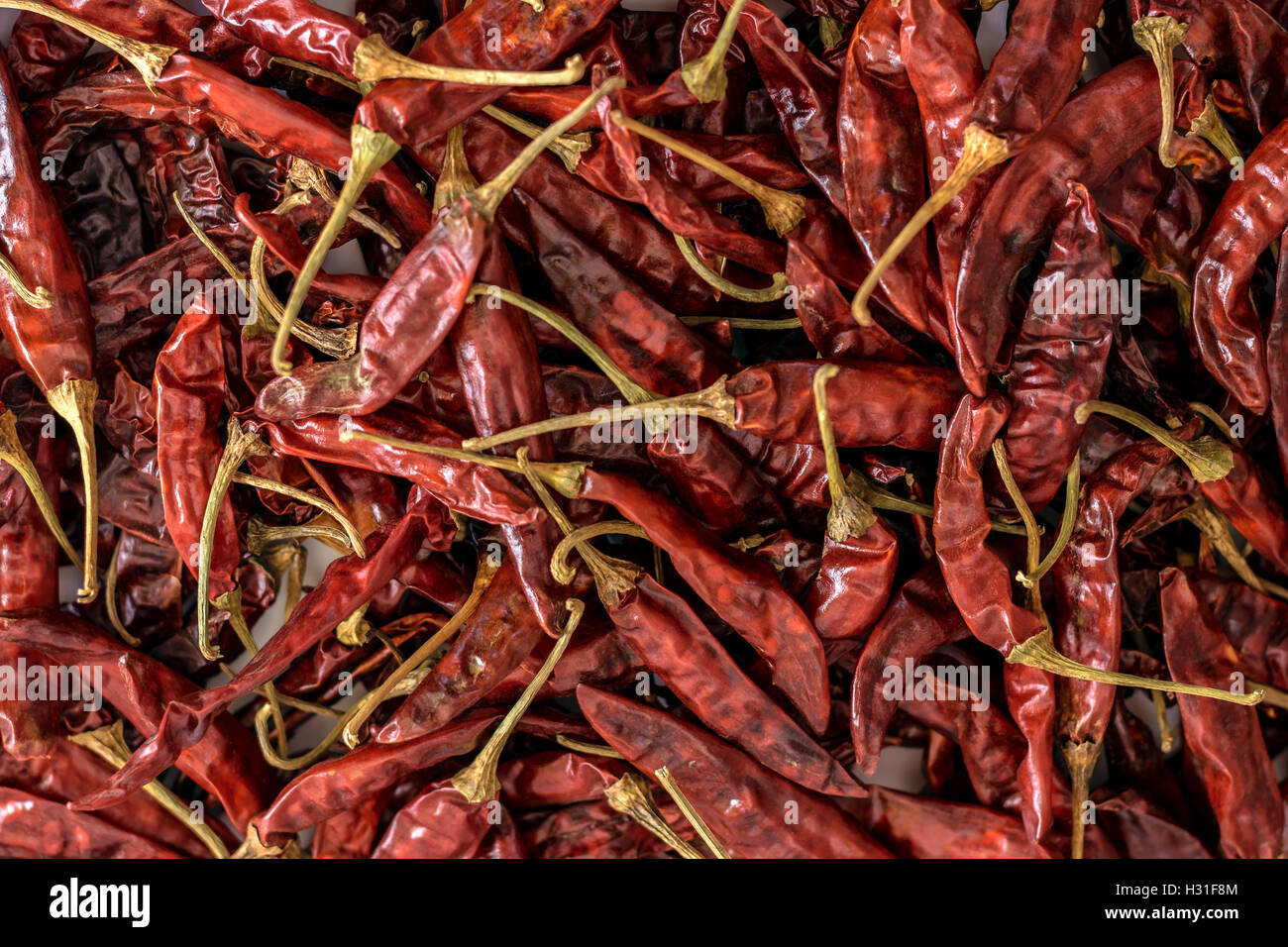 Dried Organic Indian Red Chilles background Stock Photo - Alamy