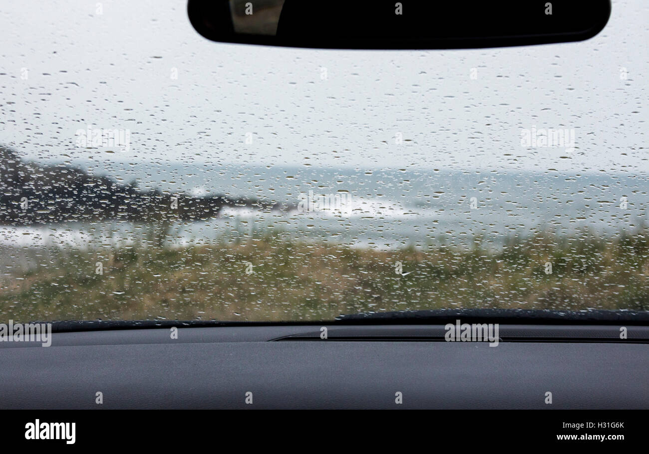 View through wet windscreen to coast Anglesey Wales UK Stock Photo - Alamy