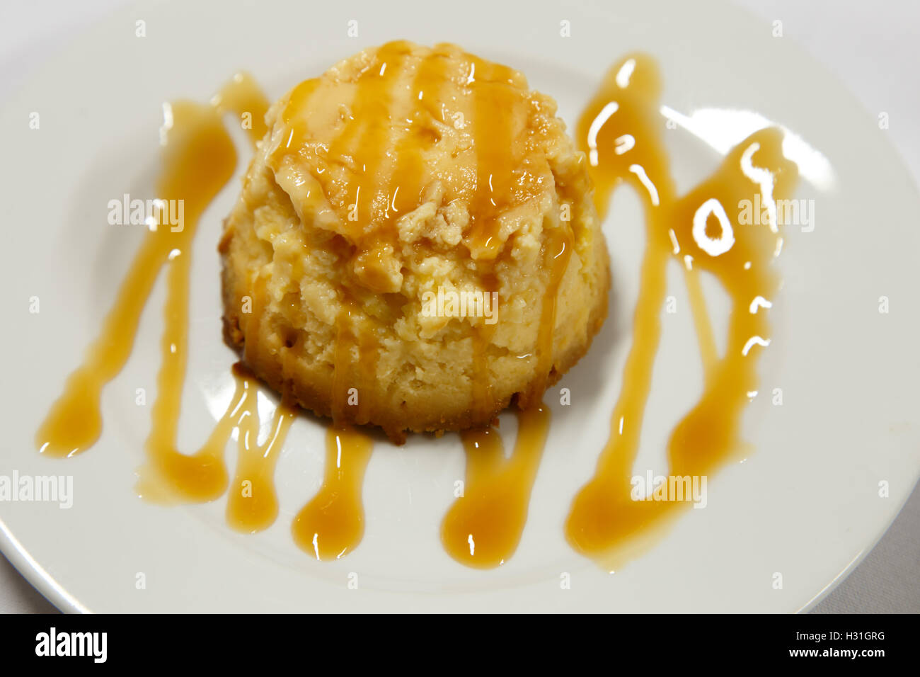 French creme caramel dessert served on plate Stock Photo - Alamy