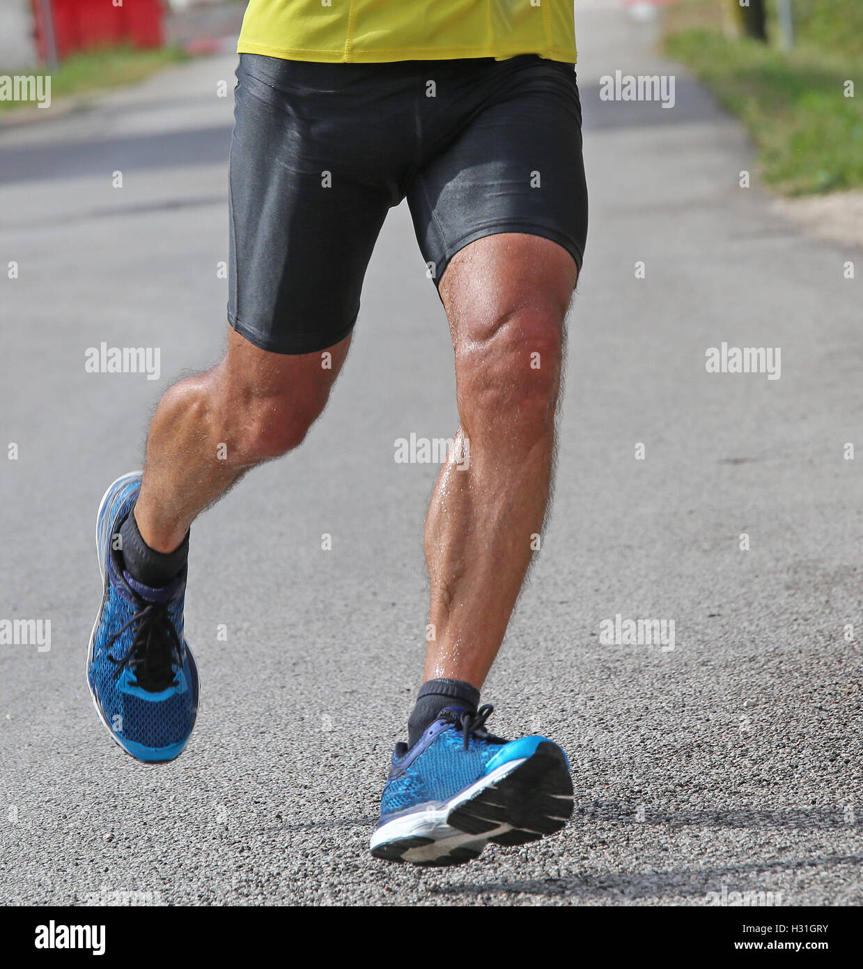 muscular runner during a cross-country race Stock Photo - Alamy