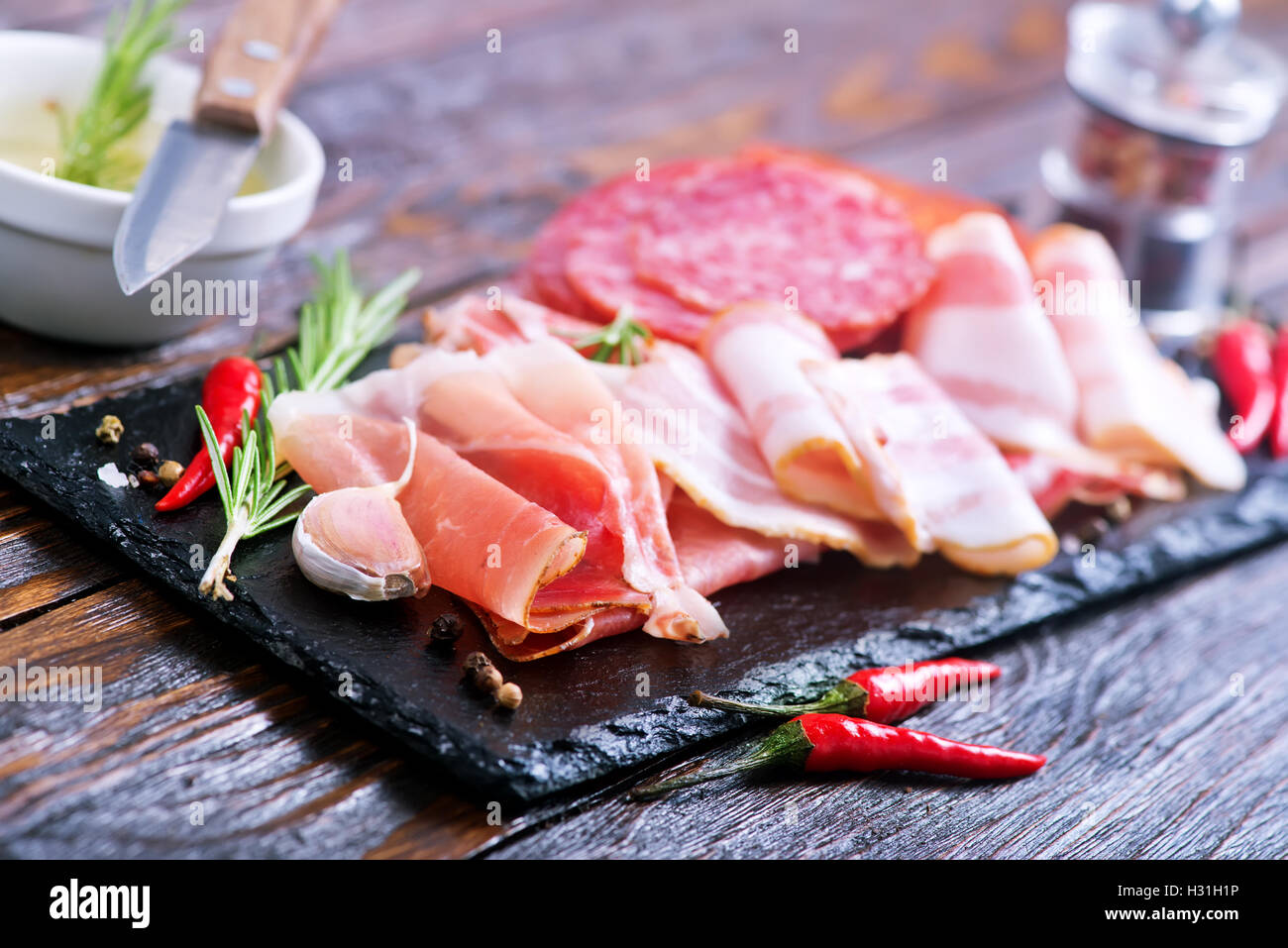Delicious and tasty meat dishes on the board Stock Photo - Alamy