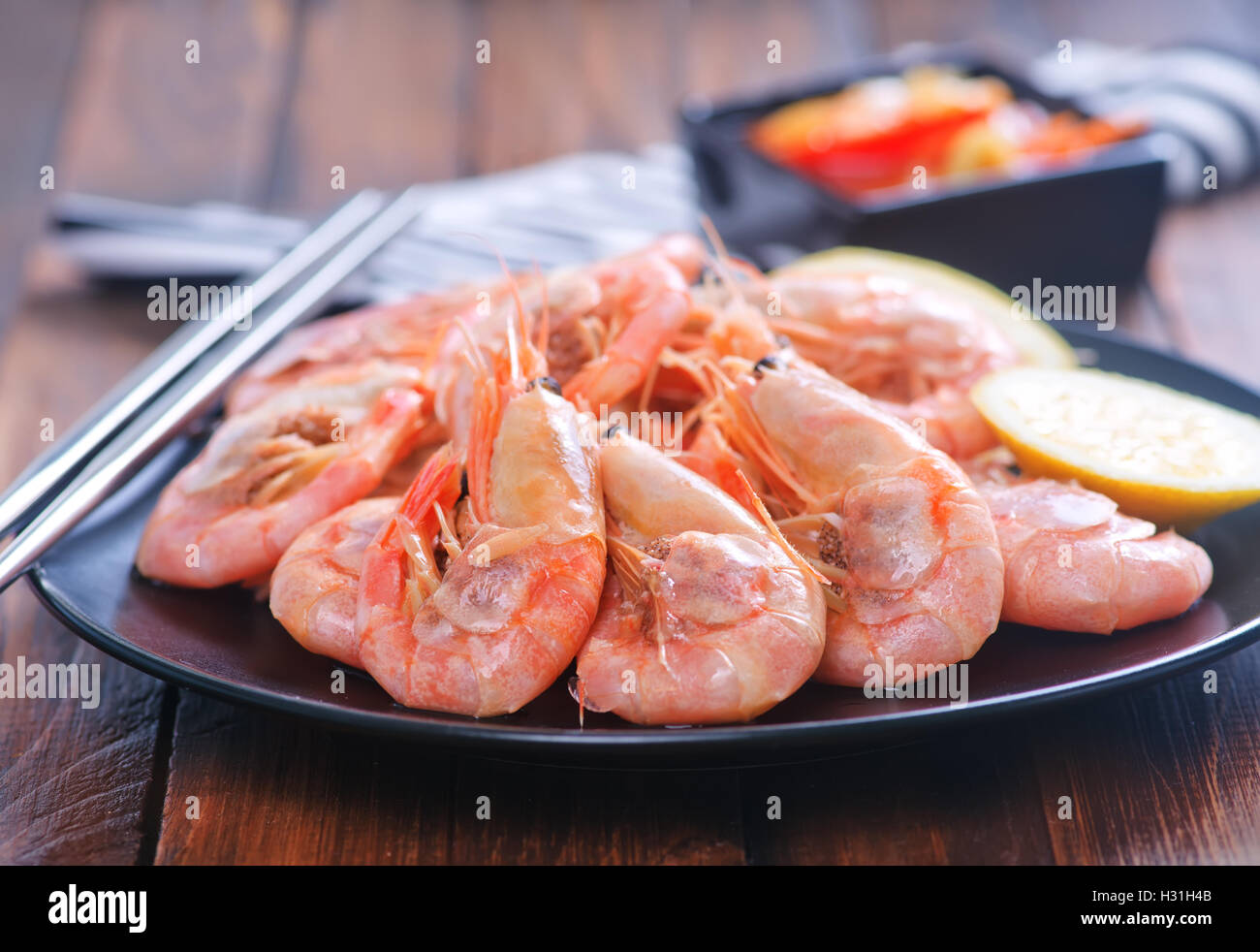 shrimps on plate and on a table Stock Photo - Alamy