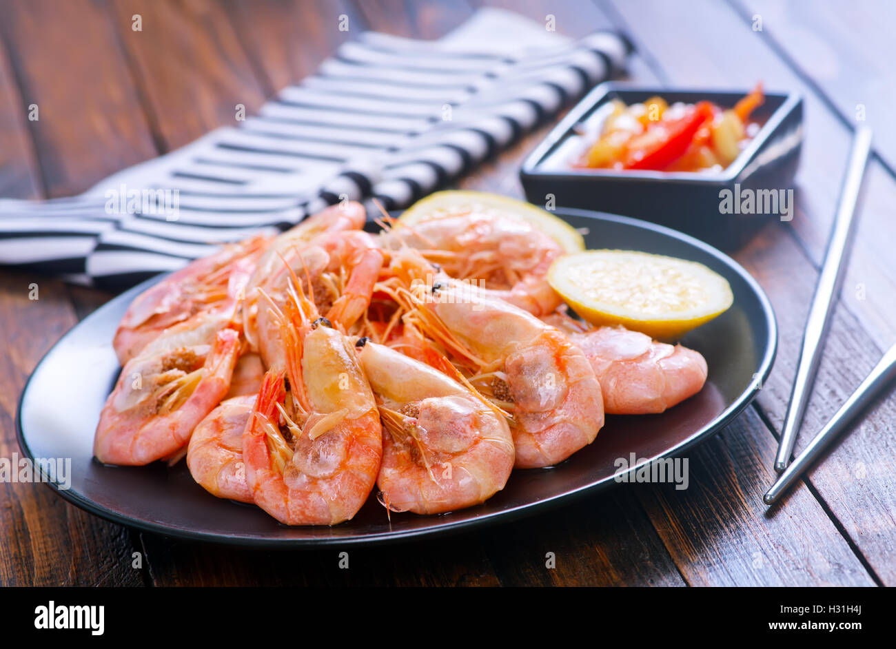 shrimps on plate and on a table Stock Photo - Alamy