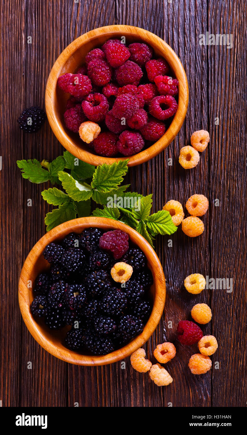 fresh berries in bowl and on a table Stock Photo - Alamy