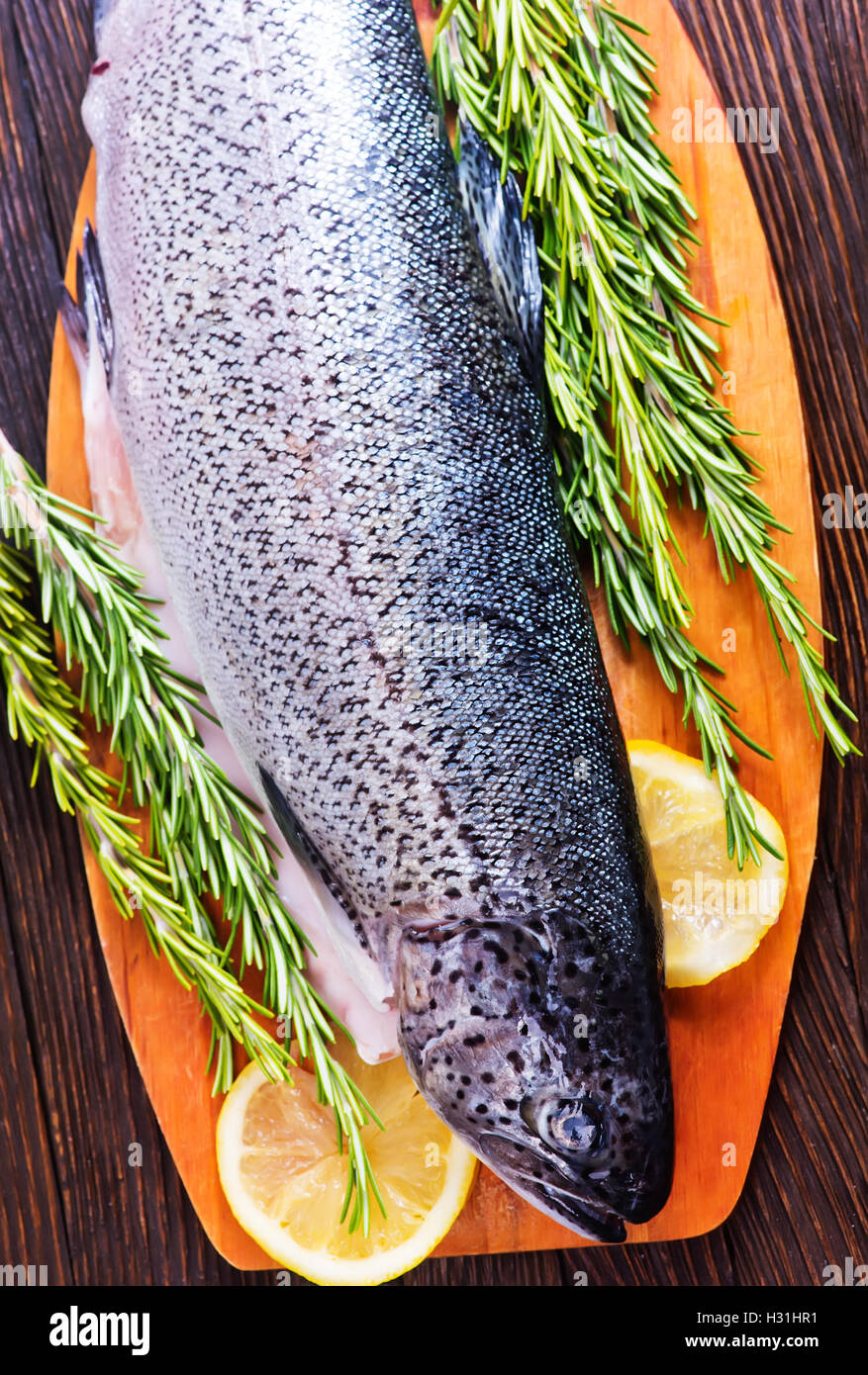 raw fish with spice and salt on a table Stock Photo - Alamy
