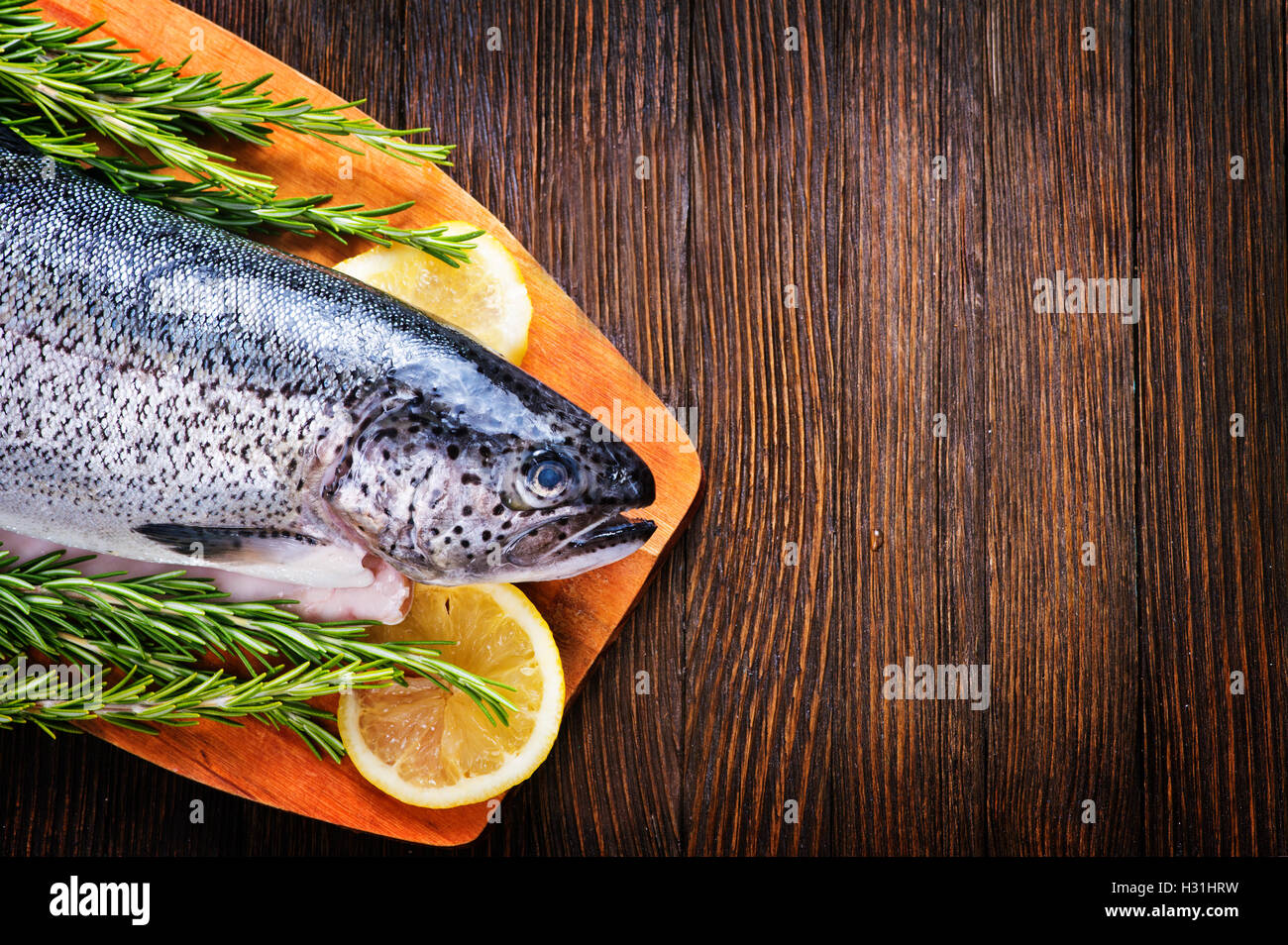 raw fish with spice and salt on a table Stock Photo - Alamy