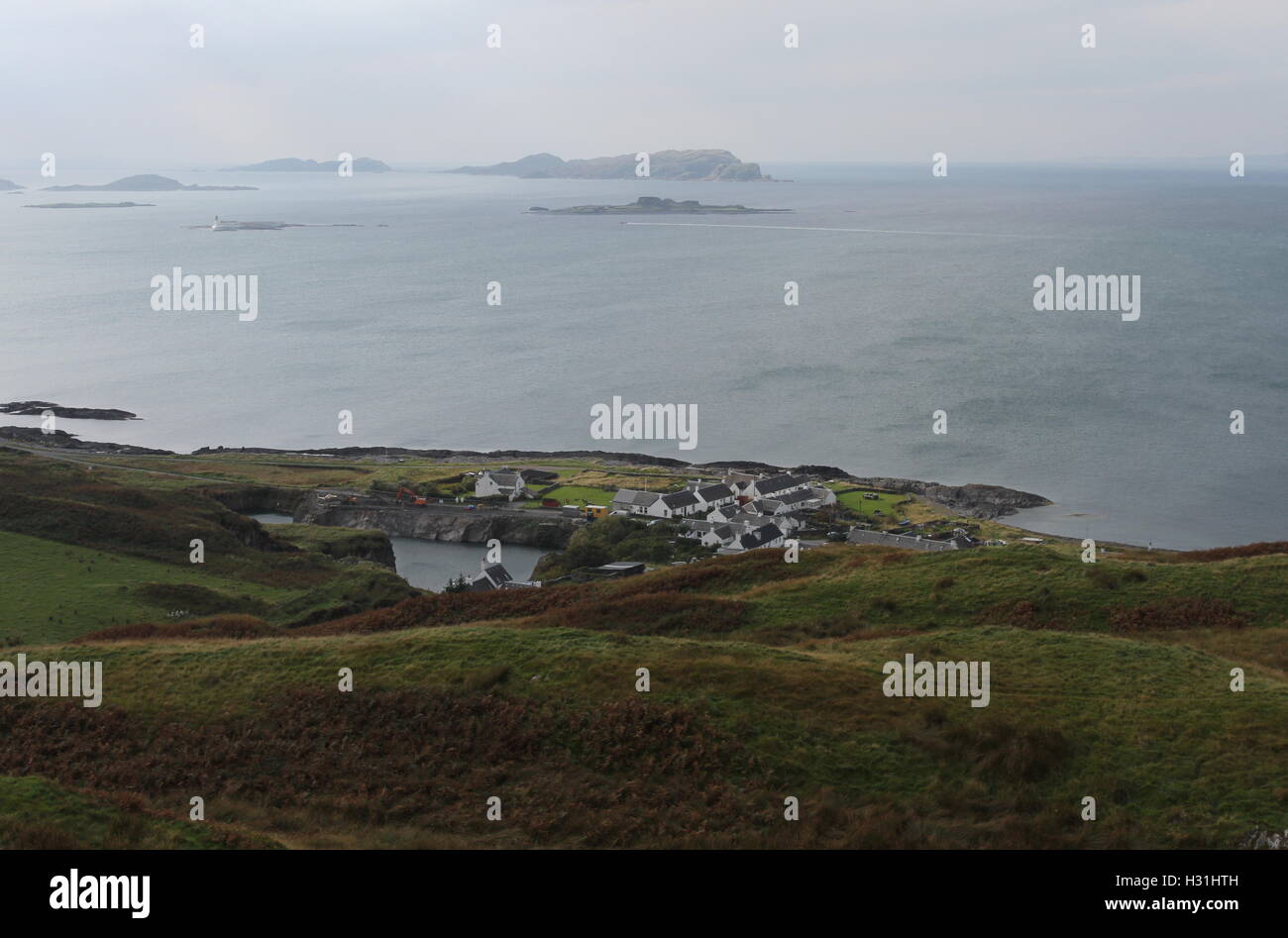 Elevated view of Cullipool on Isle of Luing with islands including ...