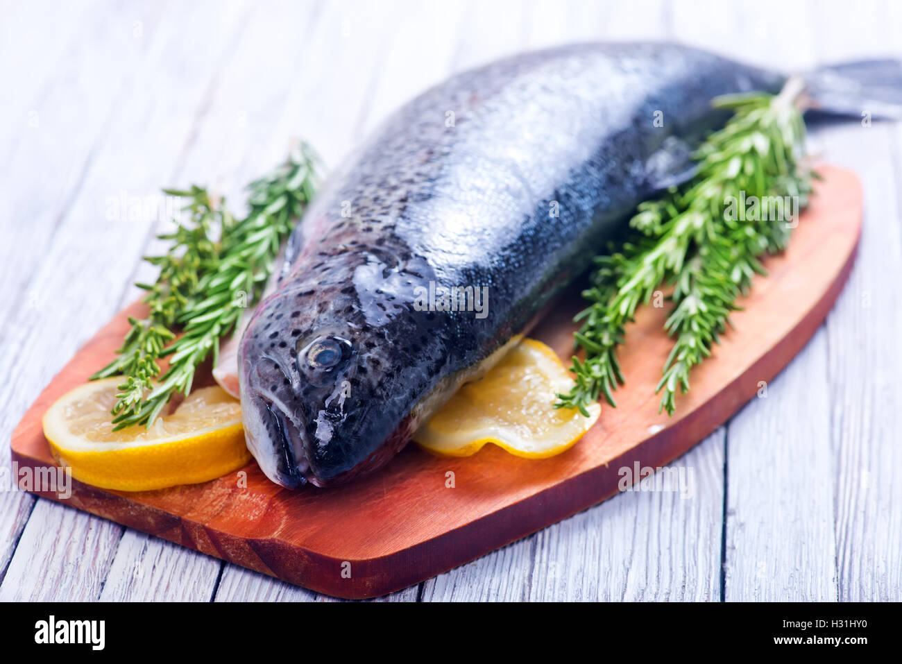 raw fish with spice and salt on a table Stock Photo - Alamy