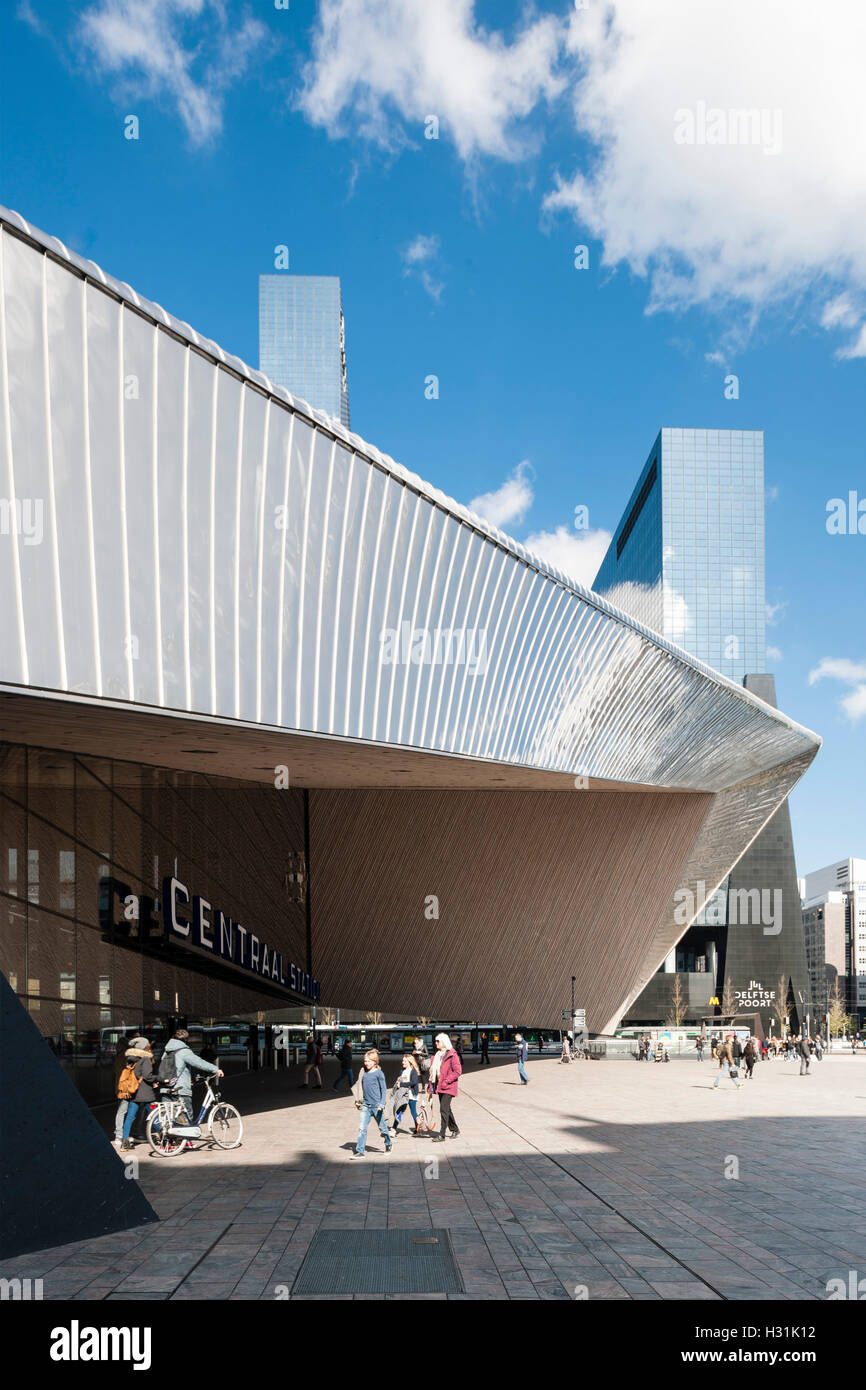 Main entrance angular view of metal clad canopy, high rise buildings ...
