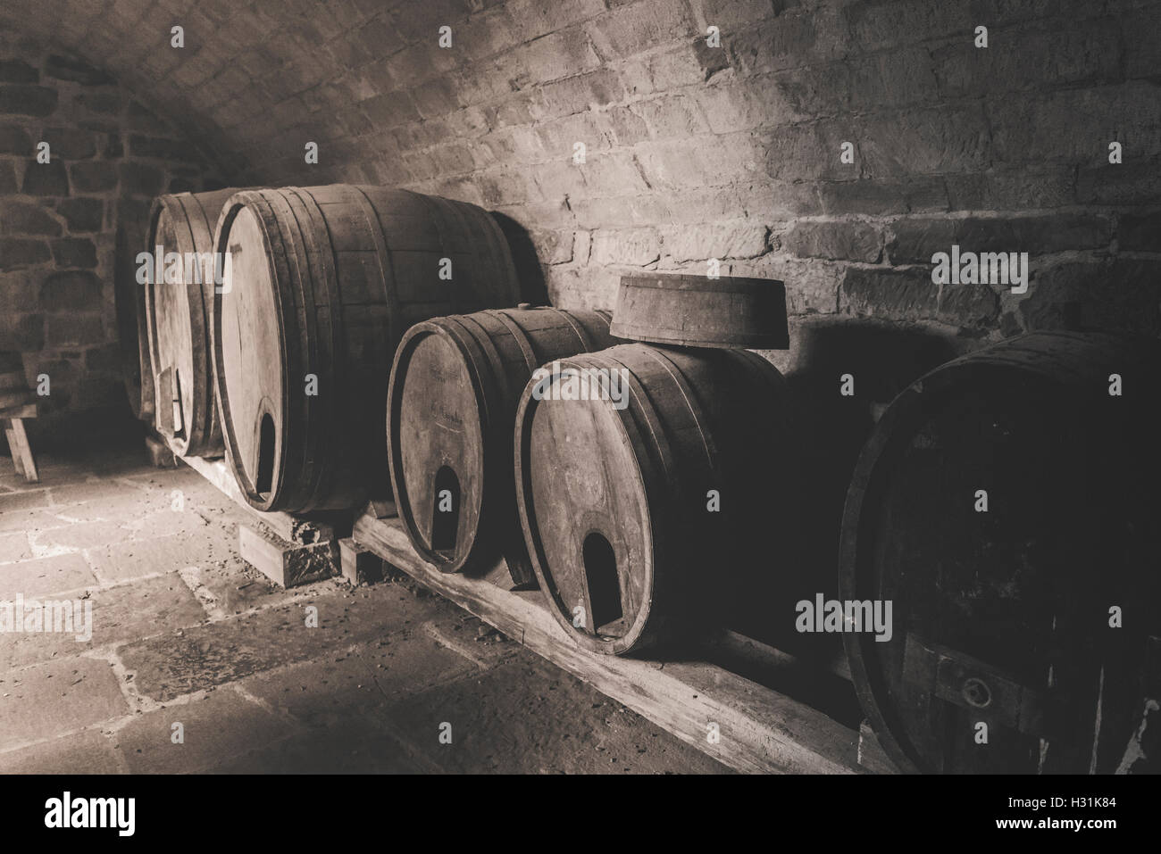 Retro style image with the interior of an old wine cellar, with stone ...